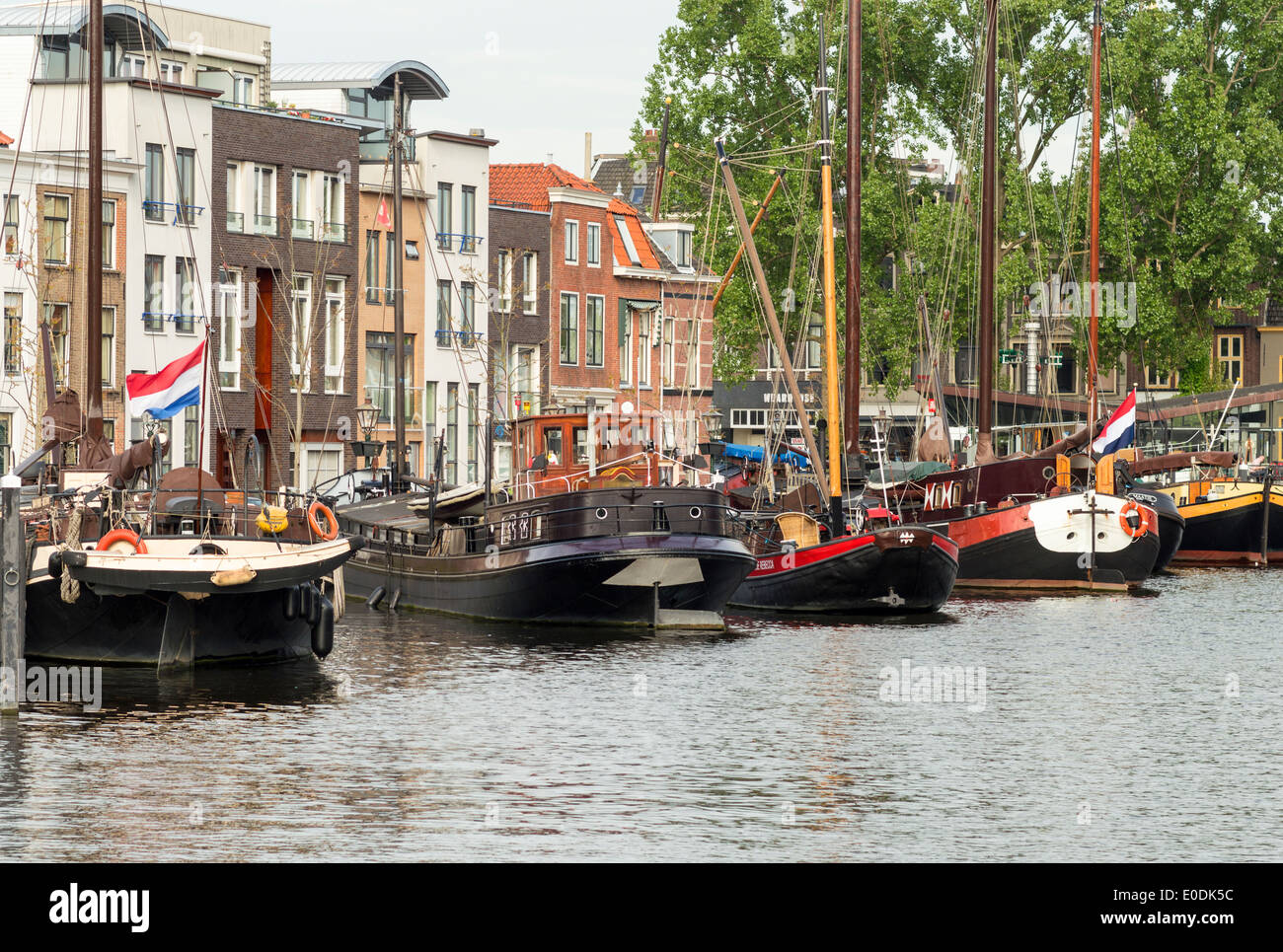 OLD RENOVATED DUTCH BARGES MOORED IN GALGEWATER CANAL LEIDEN HOLLAND ...