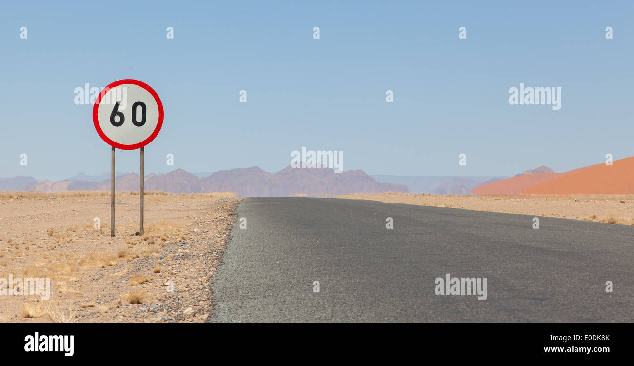 Speed limit sign at a desert road in Namibia, speed limit of 60 kph ...