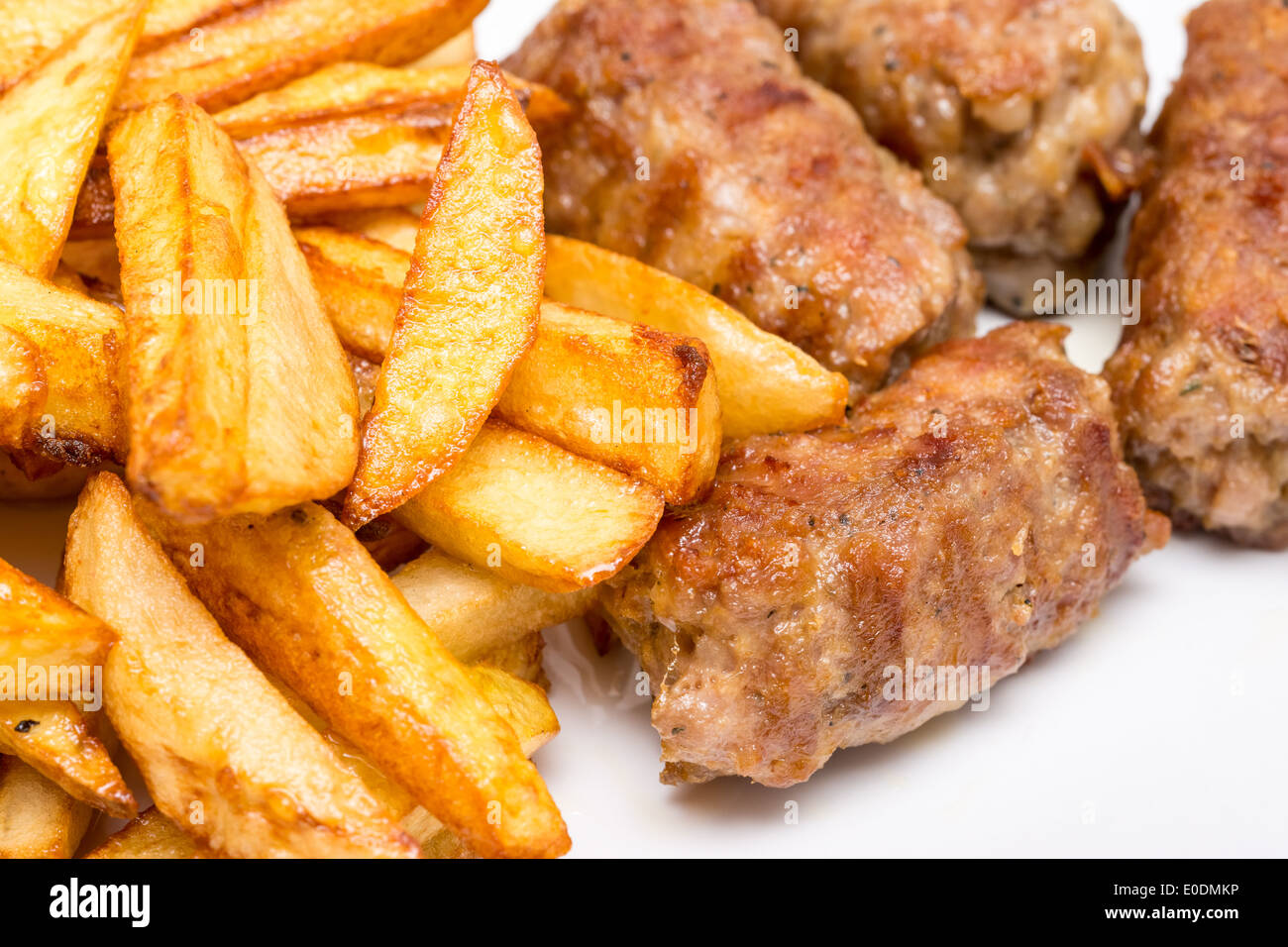 Traditional Romanian Dinner With Meatballs Or Mici And French Fries ...