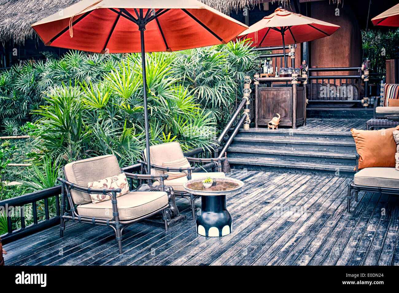 Armchairs and a table on an open terrace Stock Photo - Alamy