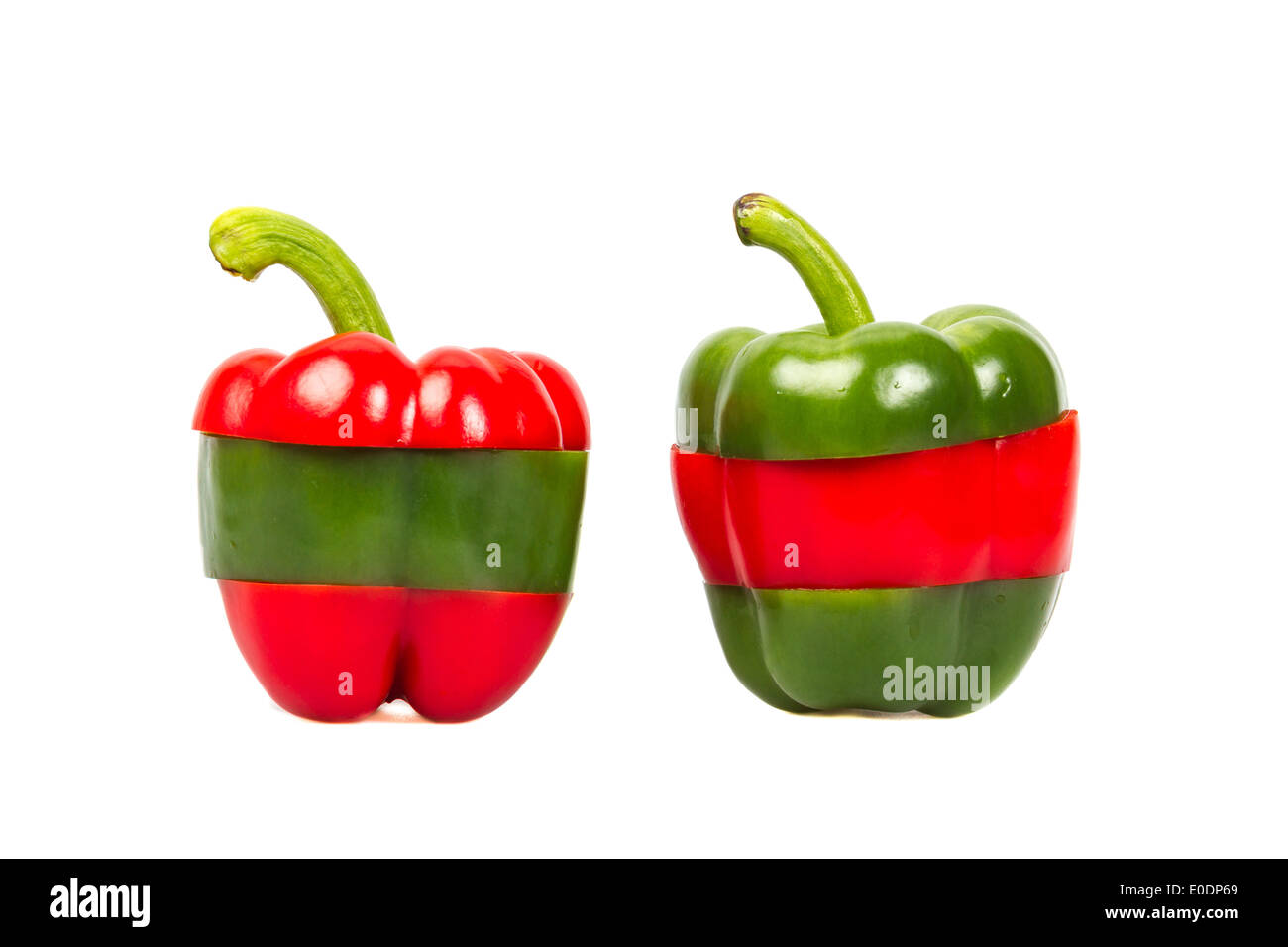 A sliced red and green pepper on a white background Stock Photo - Alamy