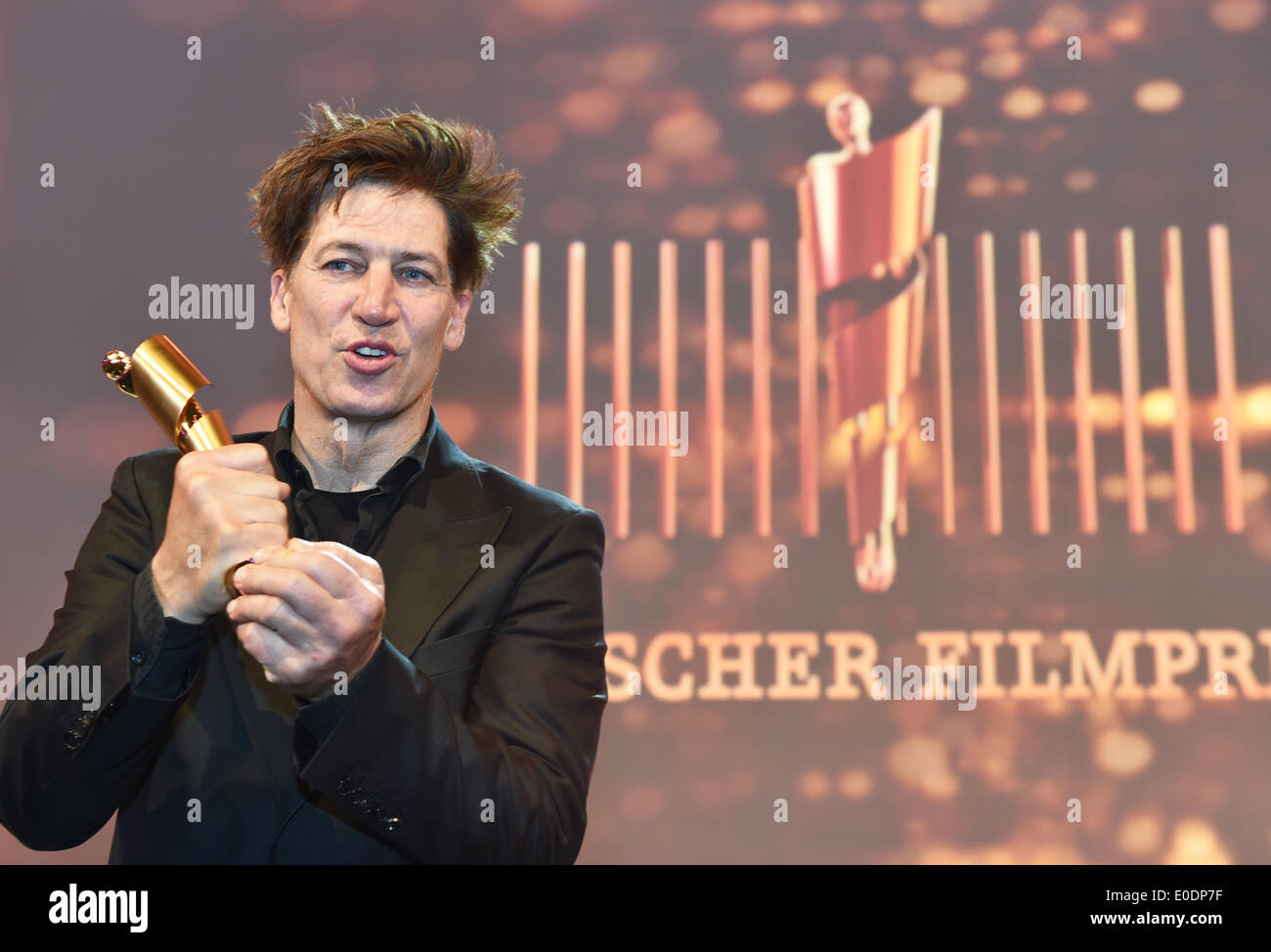 Berlin, Germany. 09th May, 2014. Actor Tobias Moretti holds the Lola ...