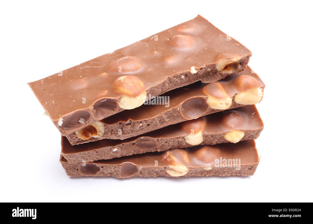 Stack of chocolate with hazelnut, chocolate pieces. Isolated on white ...