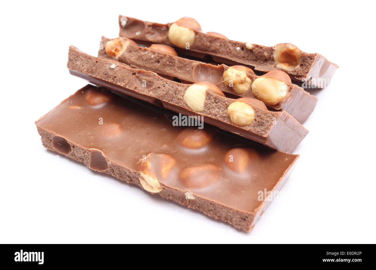 Stack of chocolate with hazelnut, chocolate pieces. Isolated on white ...
