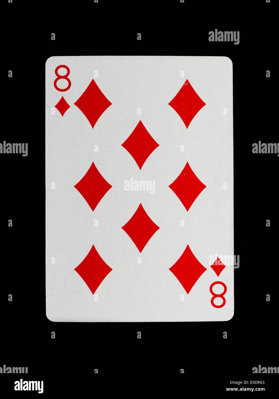Old playing card (eight) isolated on a black background Stock Photo - Alamy