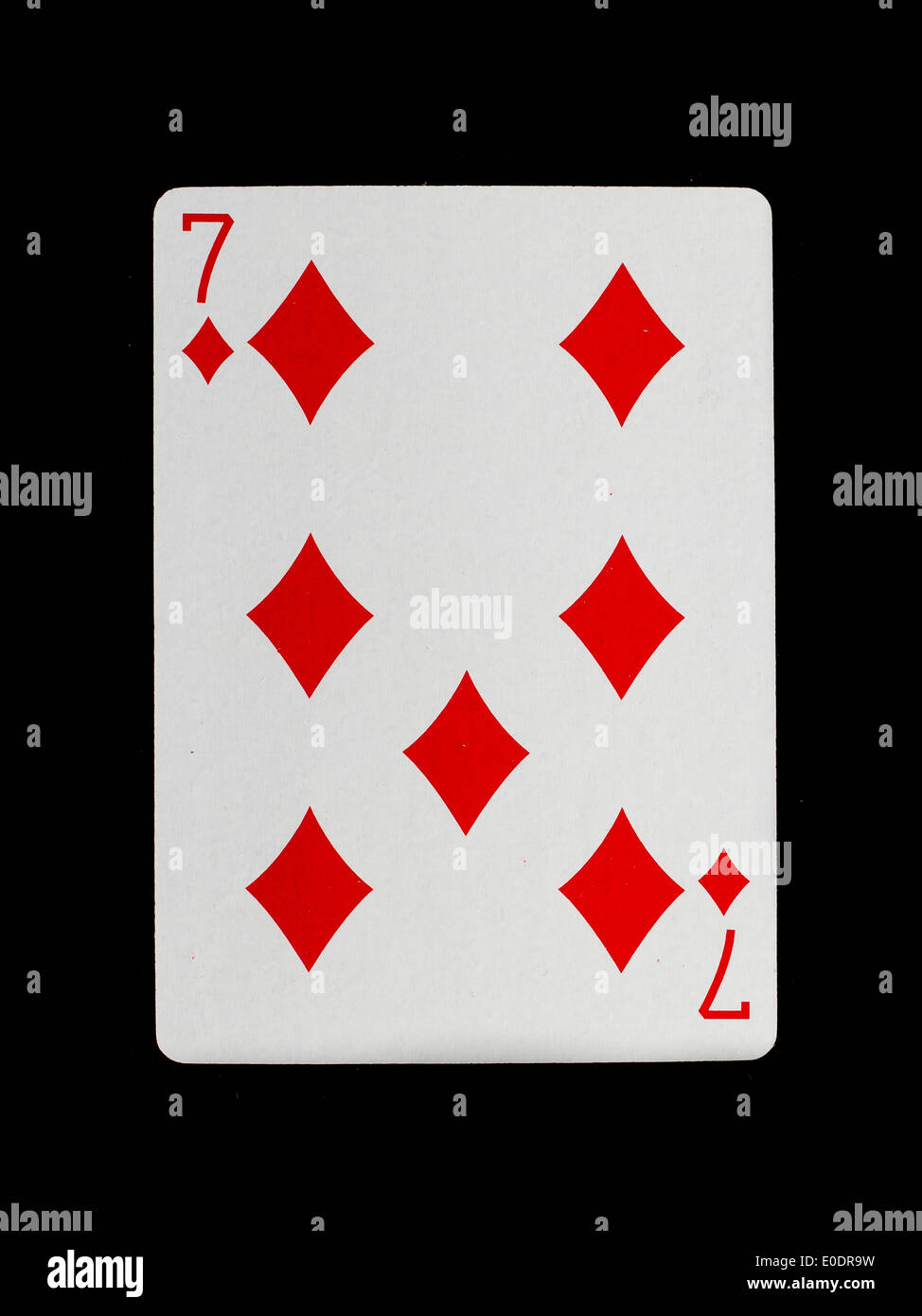 Old playing card (seven) isolated on a black background Stock Photo - Alamy