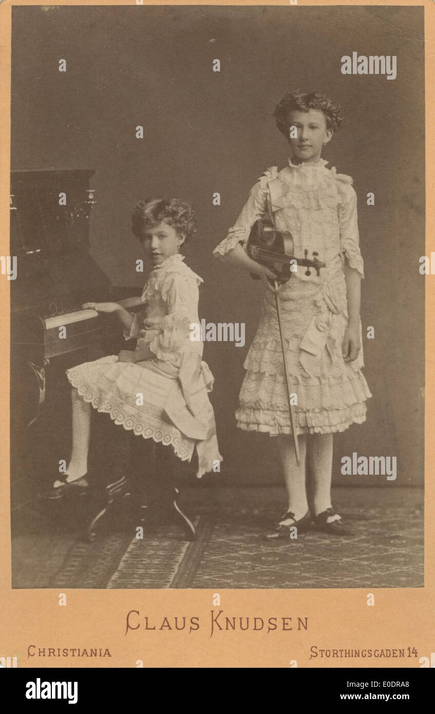 A portrait from the 1800s shows two young girls playing musical ...