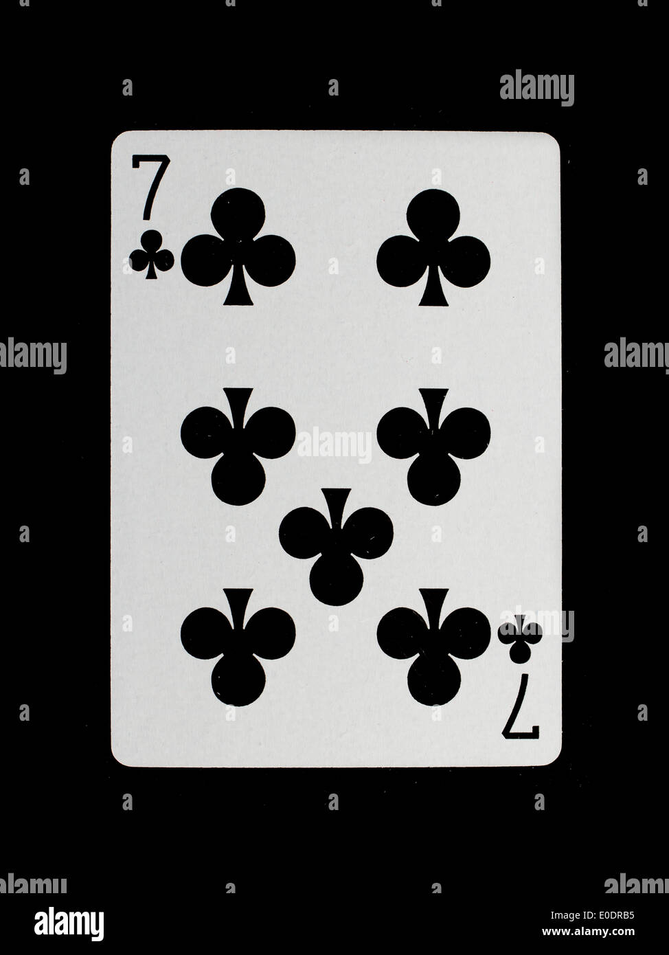 Playing card (seven) isolated on a black background Stock Photo - Alamy