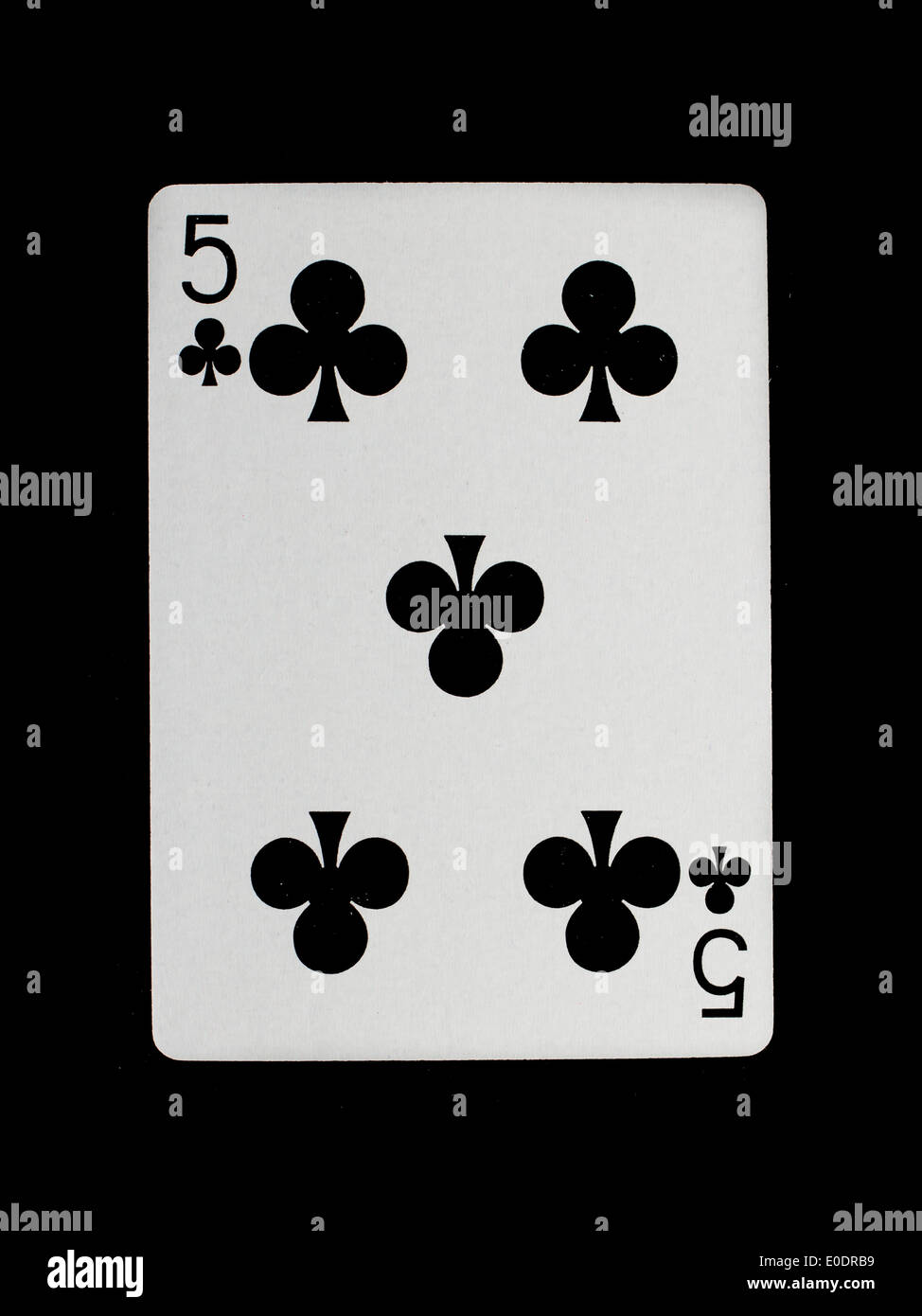 Playing card (five) isolated on a black background Stock Photo - Alamy