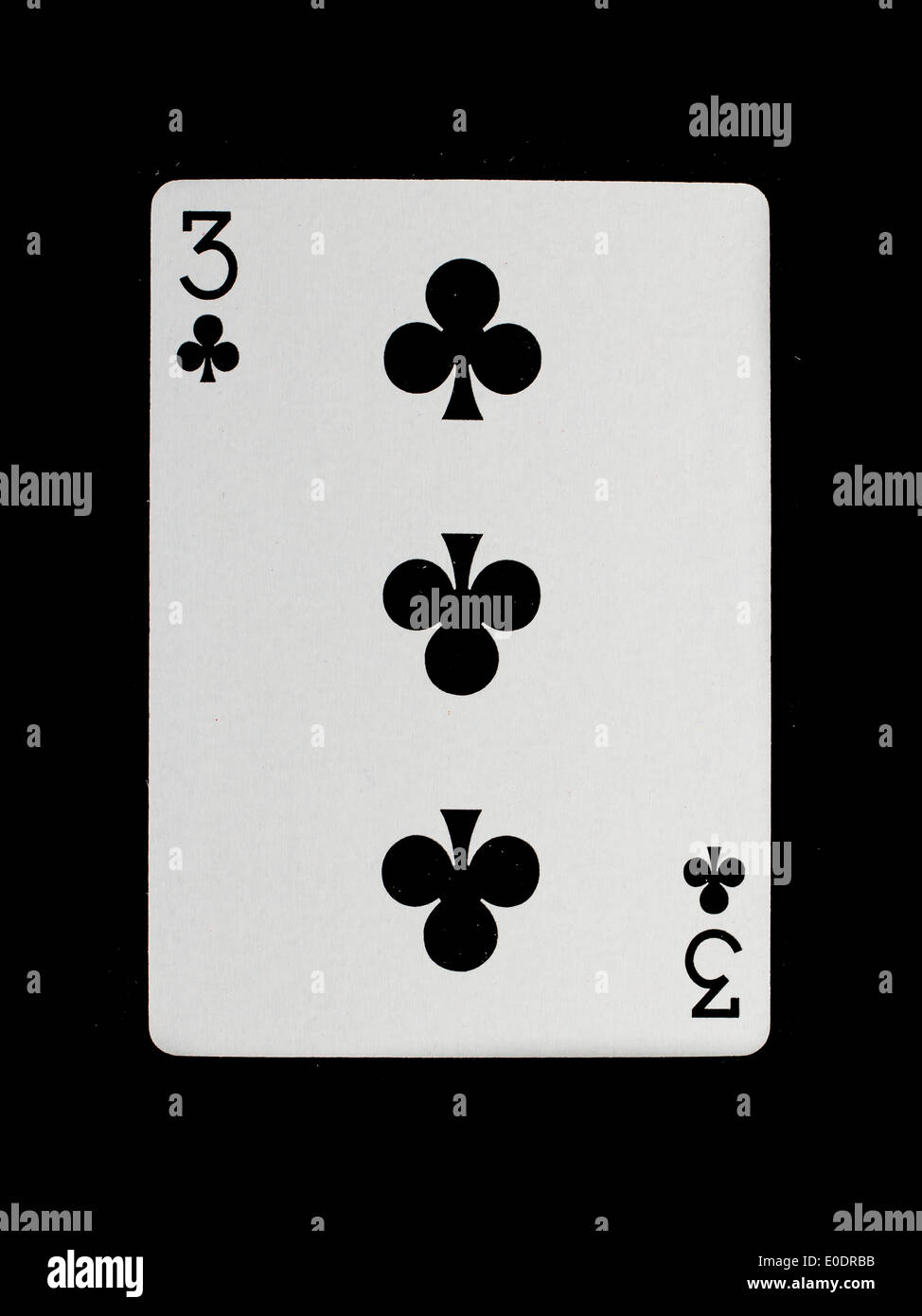 Playing card (three) isolated on a black background Stock Photo - Alamy