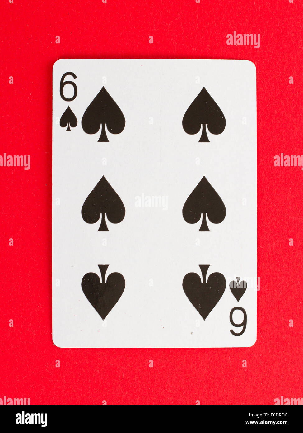 Old playing card (six) isolated on a red background Stock Photo - Alamy