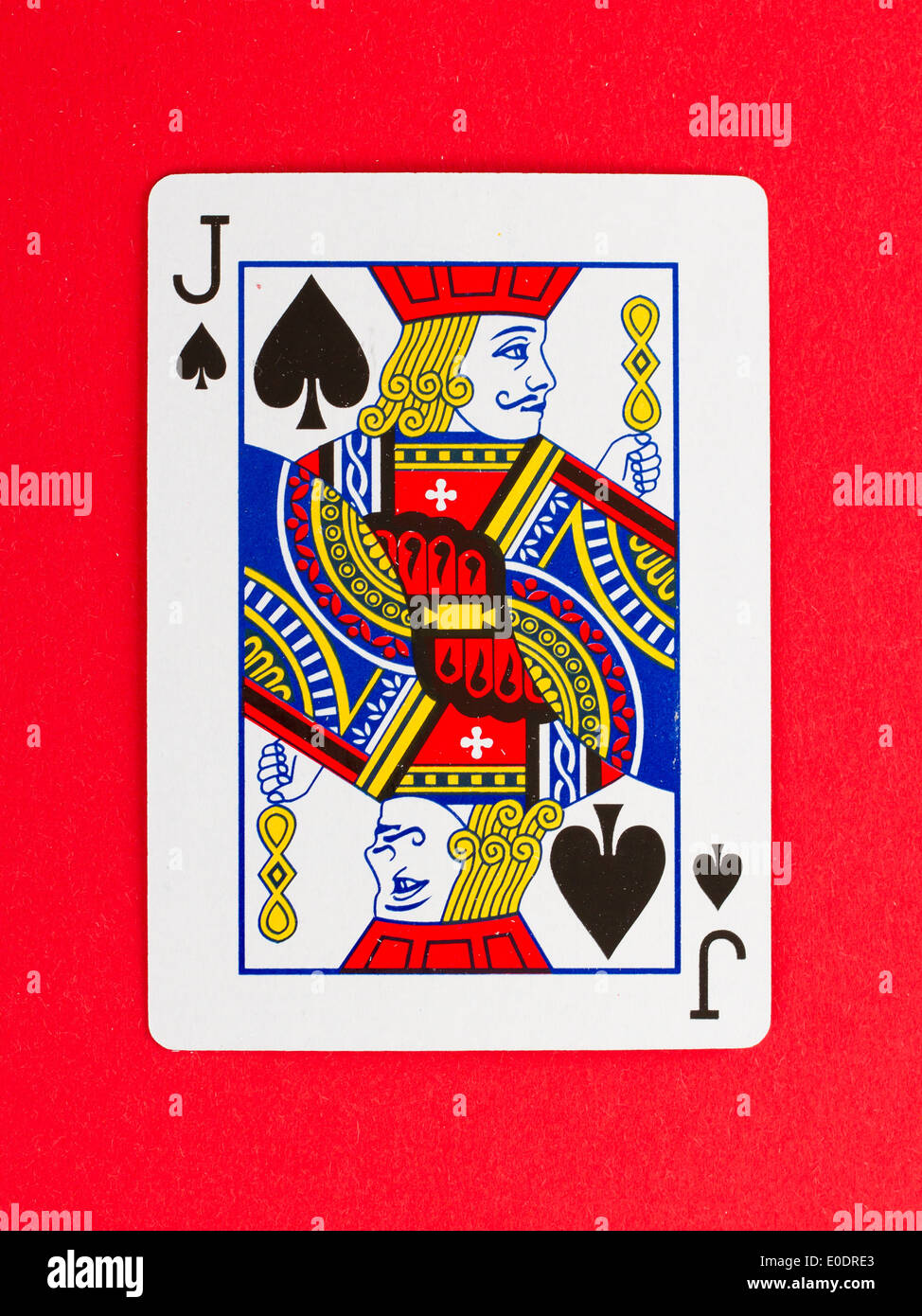 Old playing card (jack) isolated on a red background Stock Photo - Alamy