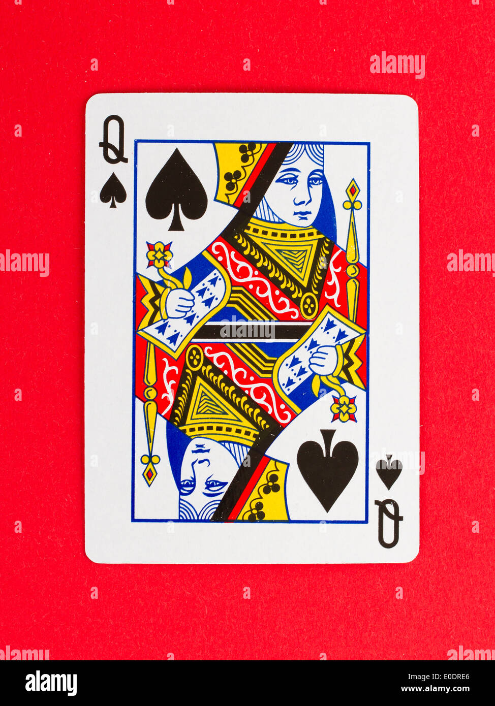 Old playing card (queen) isolated on a red background Stock Photo - Alamy