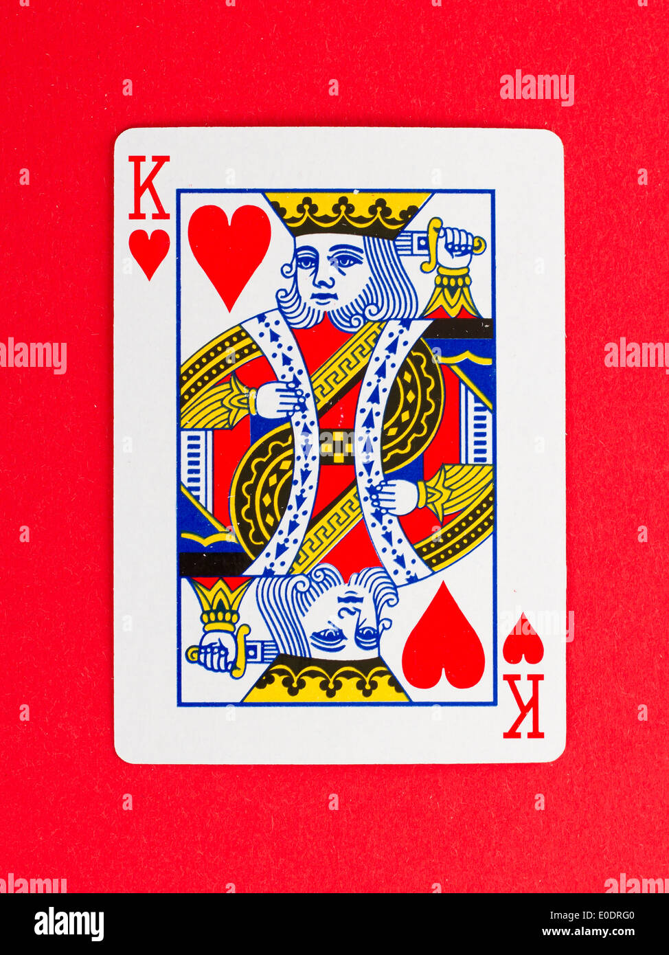 Old playing card (king) isolated on a red background Stock Photo - Alamy