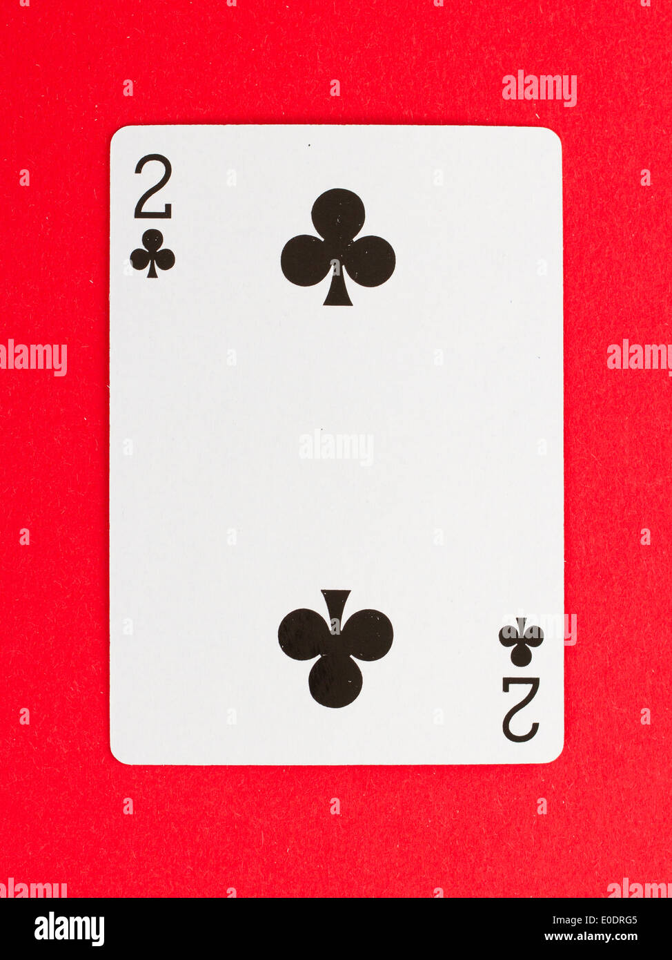 Old playing card (two) isolated on a red background Stock Photo - Alamy