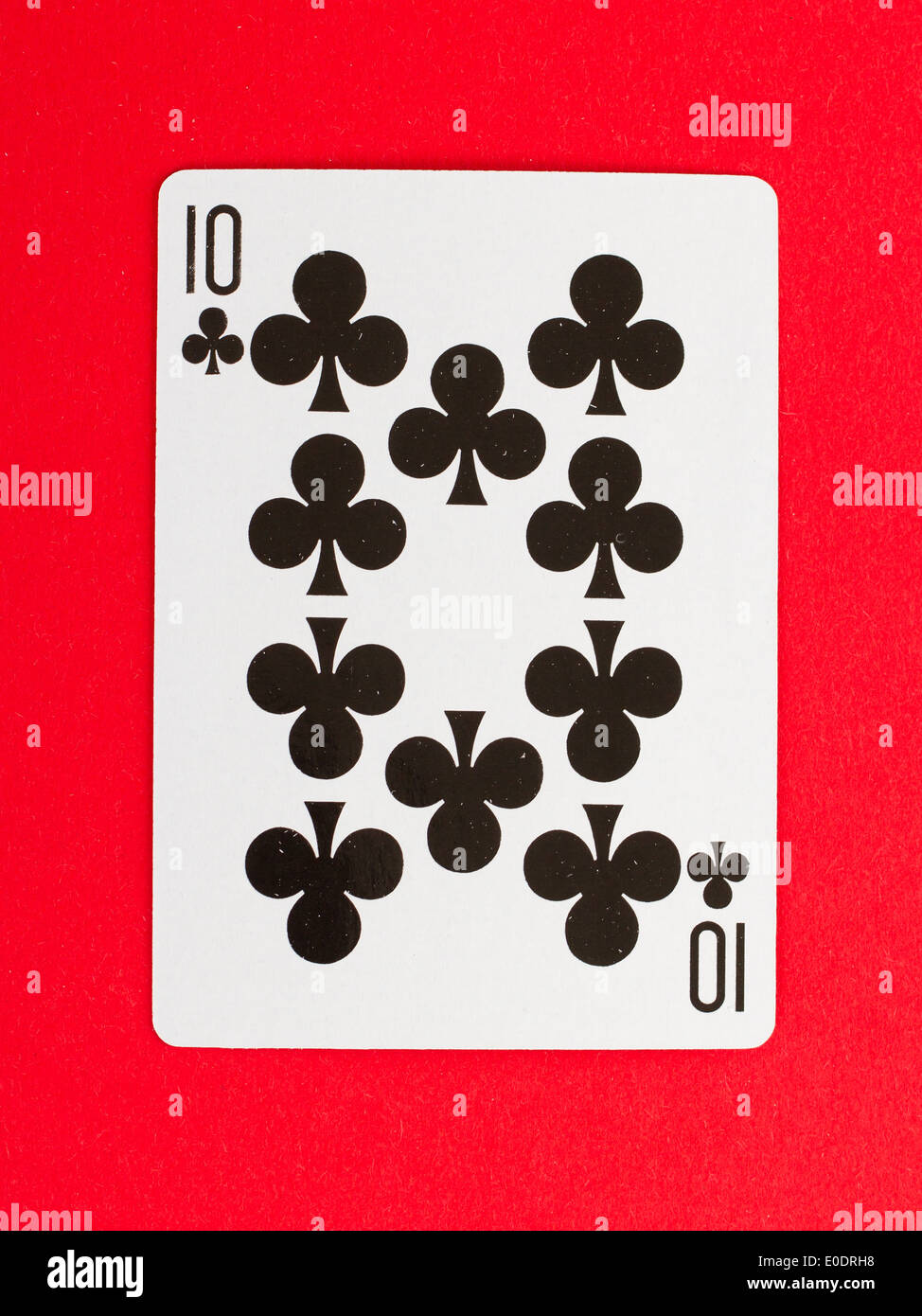 Old playing card (ten) isolated on a red background Stock Photo - Alamy