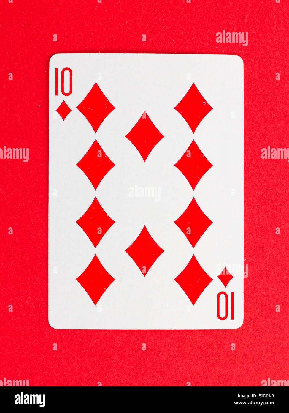Old playing card (ten) isolated on a red background Stock Photo - Alamy