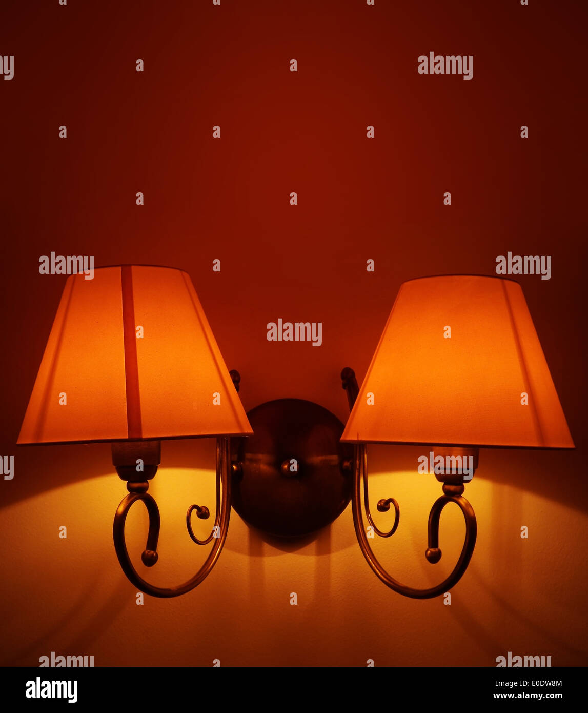 An elegant antique lamp on a dark red background Stock Photo - Alamy
