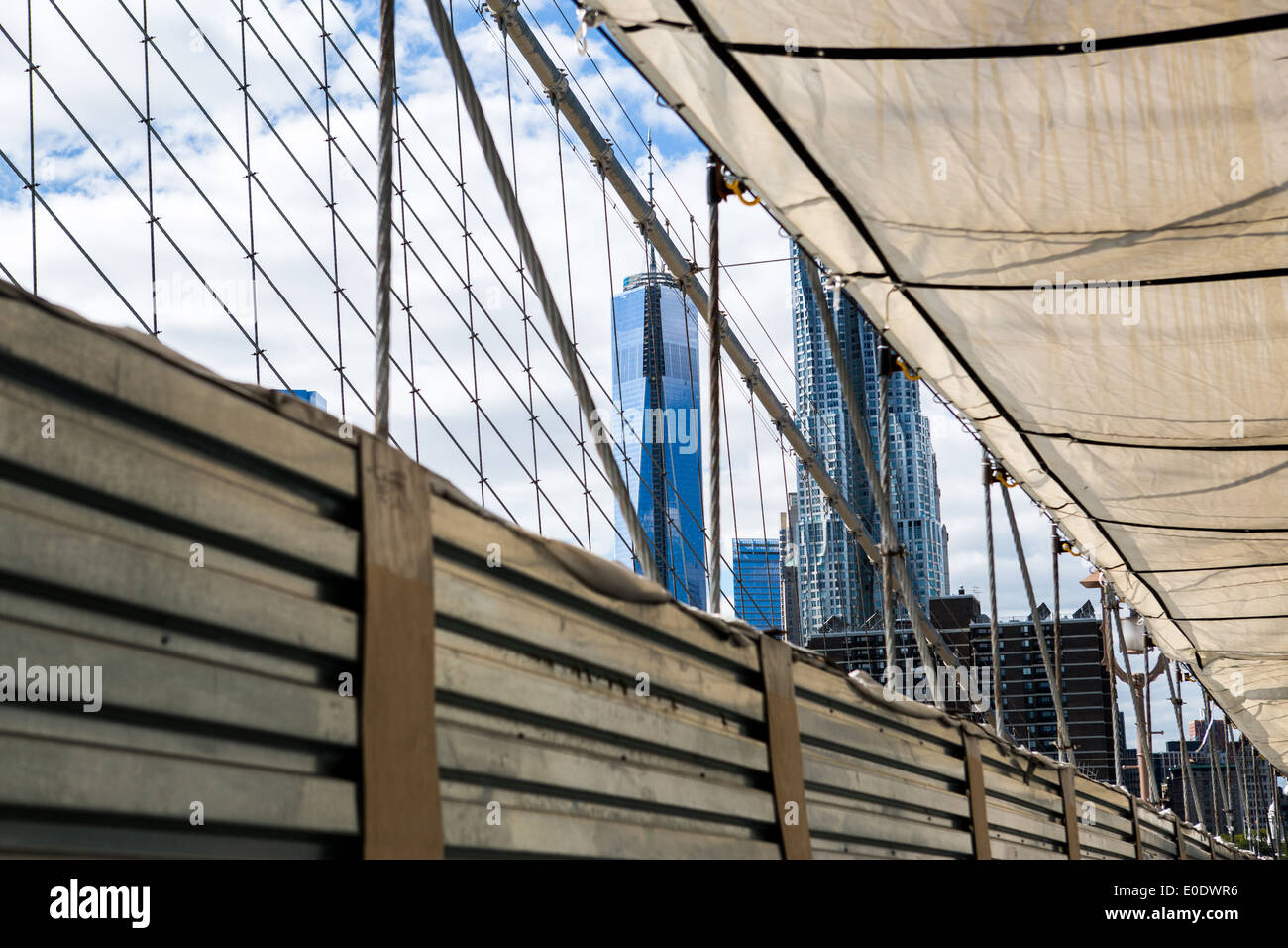 New York City buildings and bridges as seen from Brooklyn bridge under ...