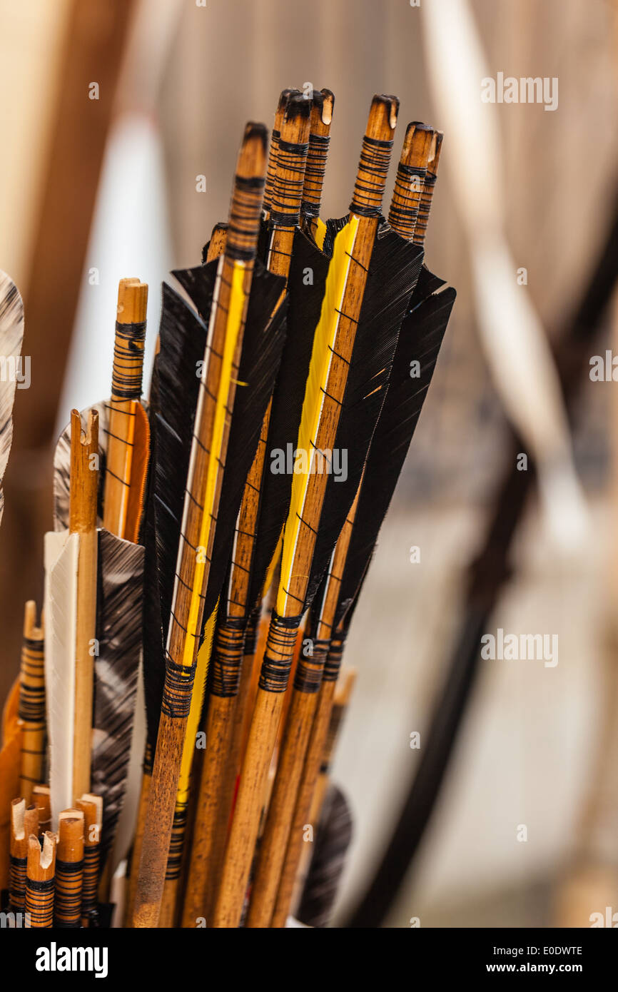 a lot of arrows with tail feathers in a medieval fair Stock Photo - Alamy