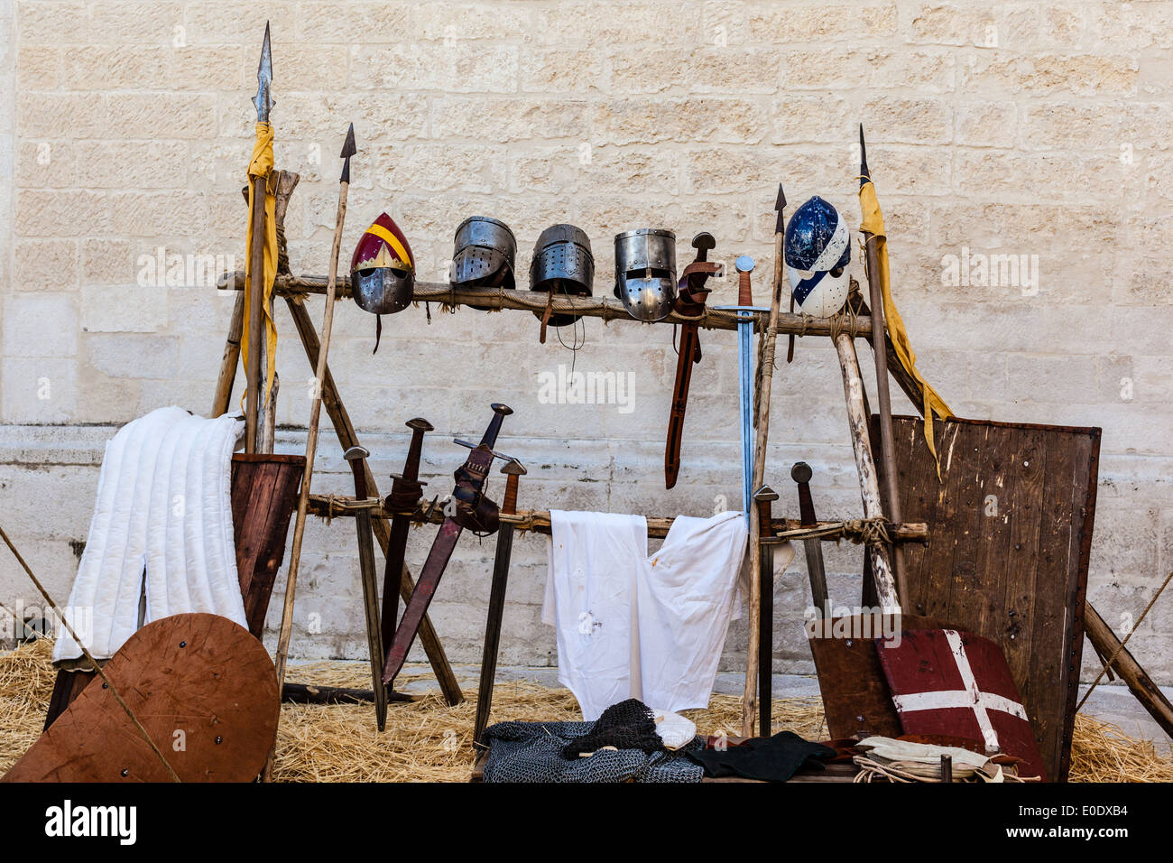 medieval shields, helm and weapons in a medieval fair in italy Stock ...
