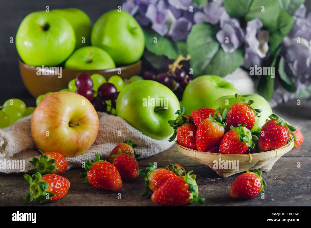 Still life with a plate full of fruit Stock Photo - Alamy
