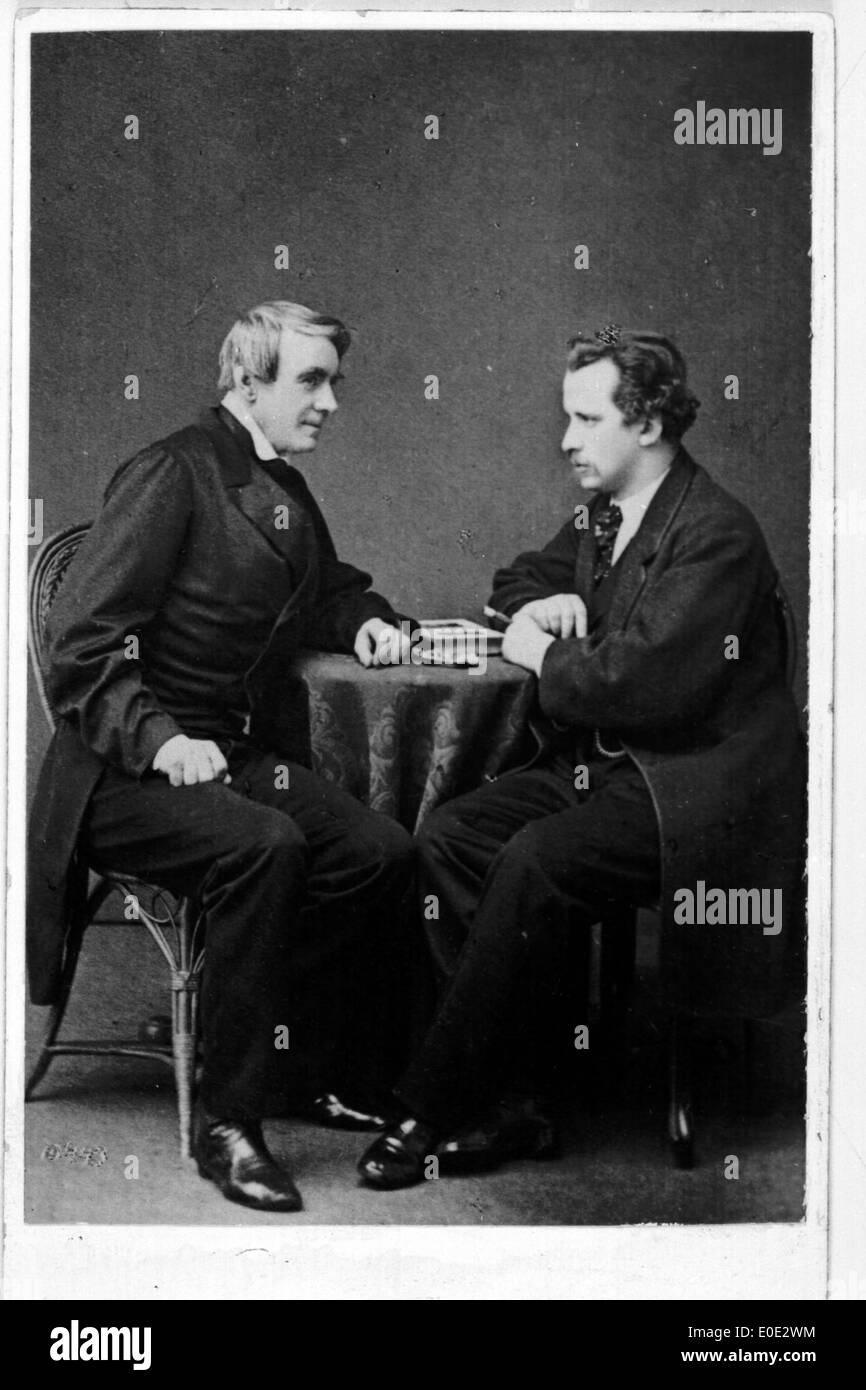 Two men at a table Stock Photo - Alamy