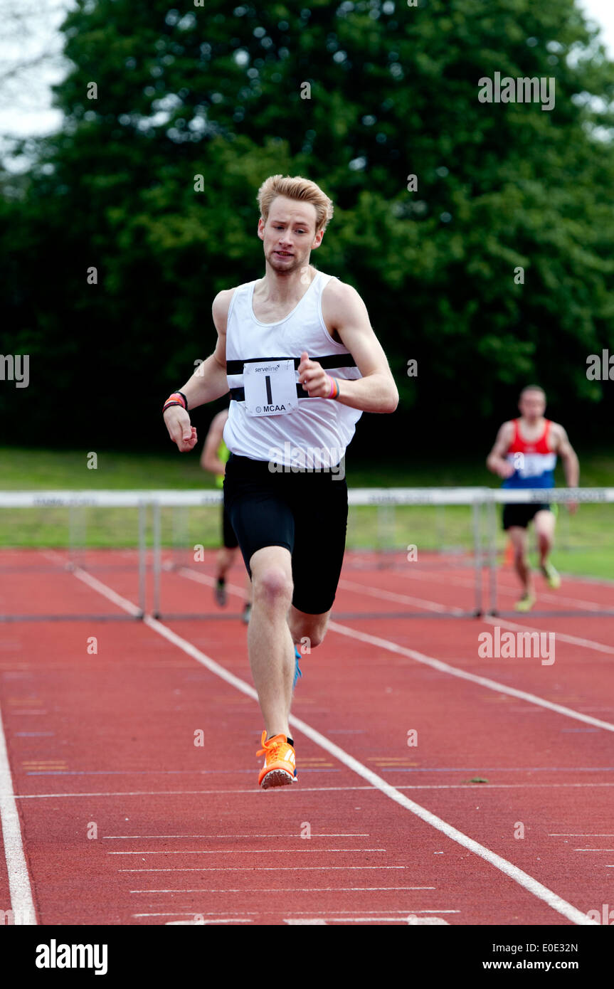 Athletics, runner in men`s 400m hurdles race at club level, UK Stock ...