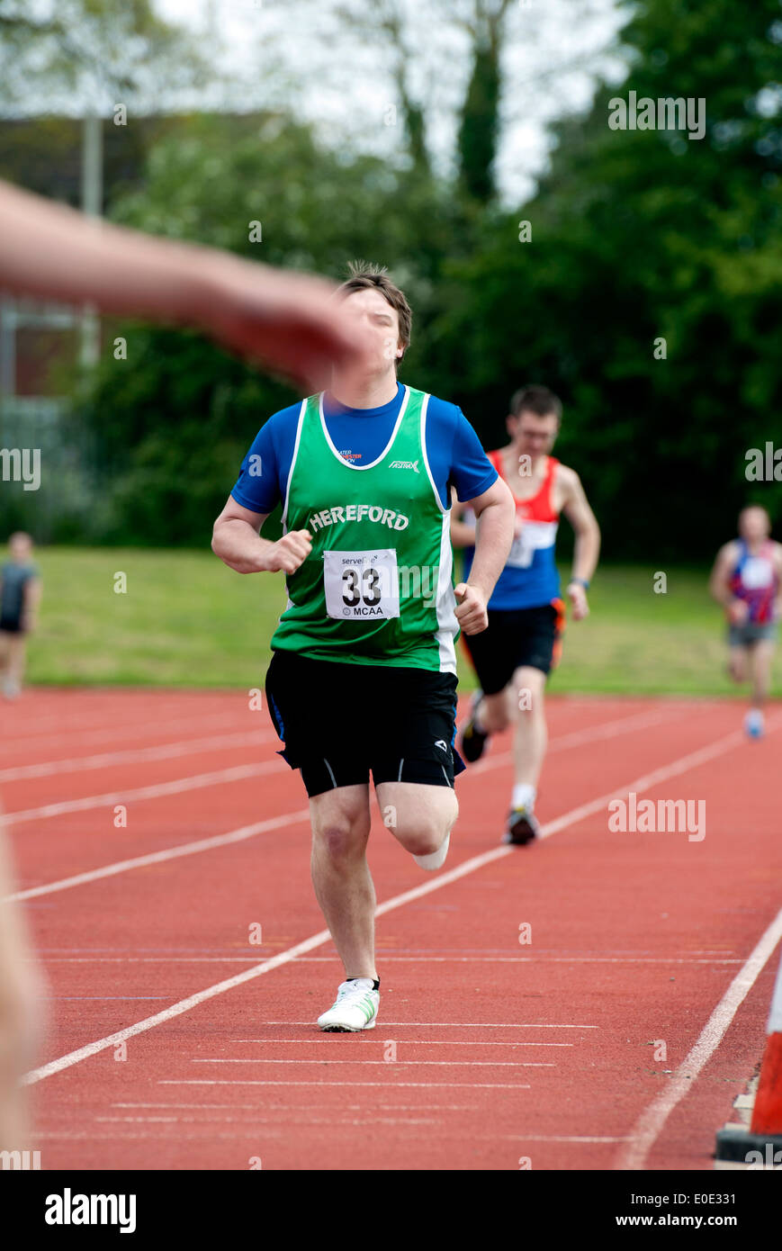Photographic error, arm in way of runner`s face Stock Photo - Alamy