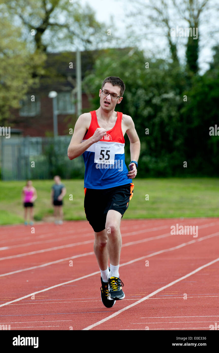Athletics, runner at finish of men`s 800m race at club level, UK Stock ...