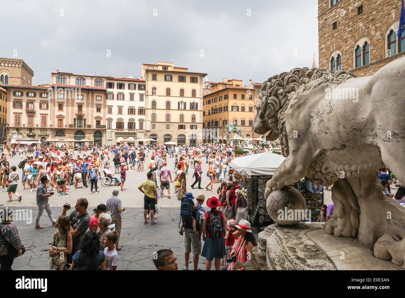 Crowded Piazza della Signoria with surrounding buildings seen from ...