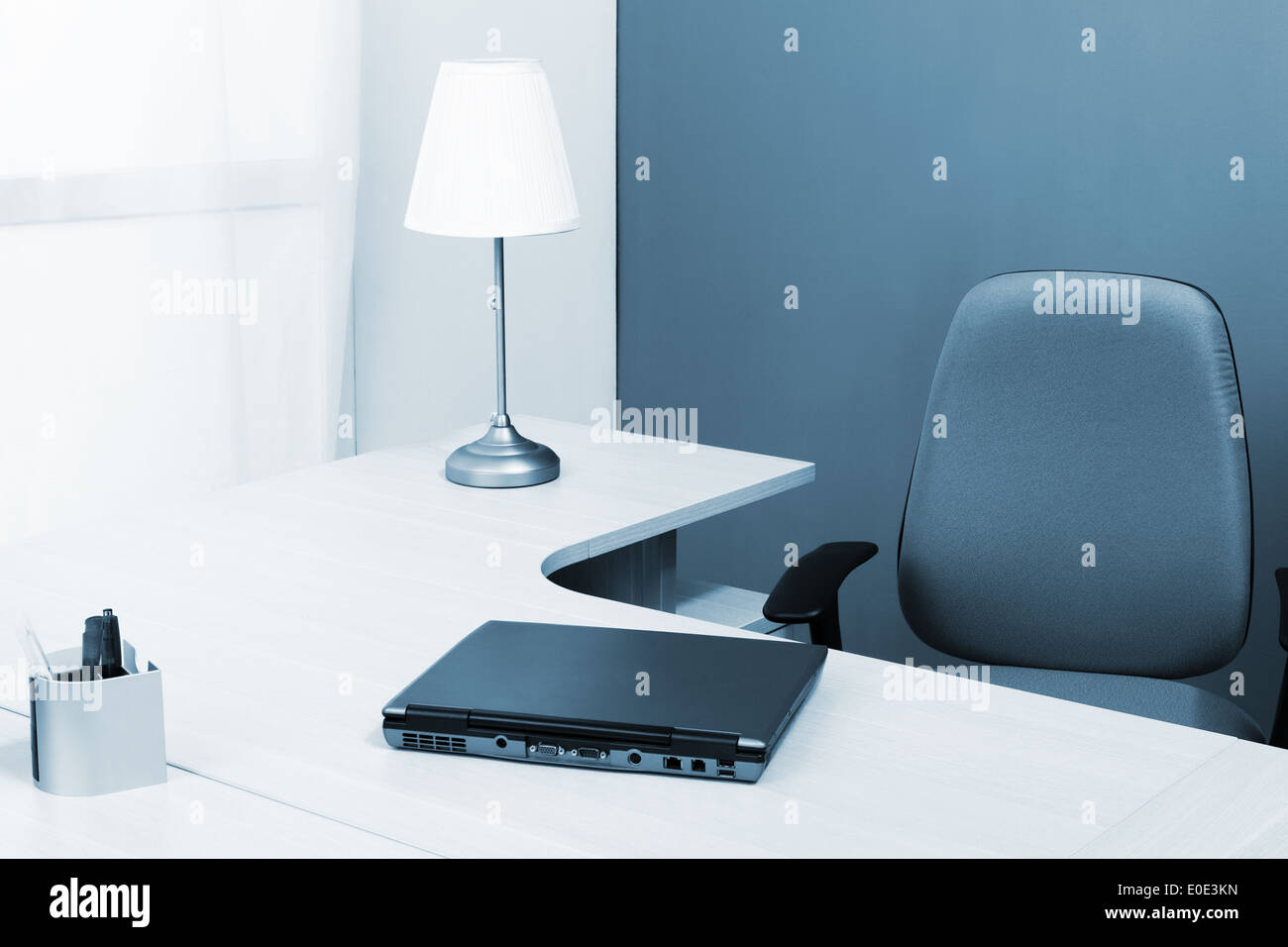laptop on a desk in a modern office Stock Photo - Alamy