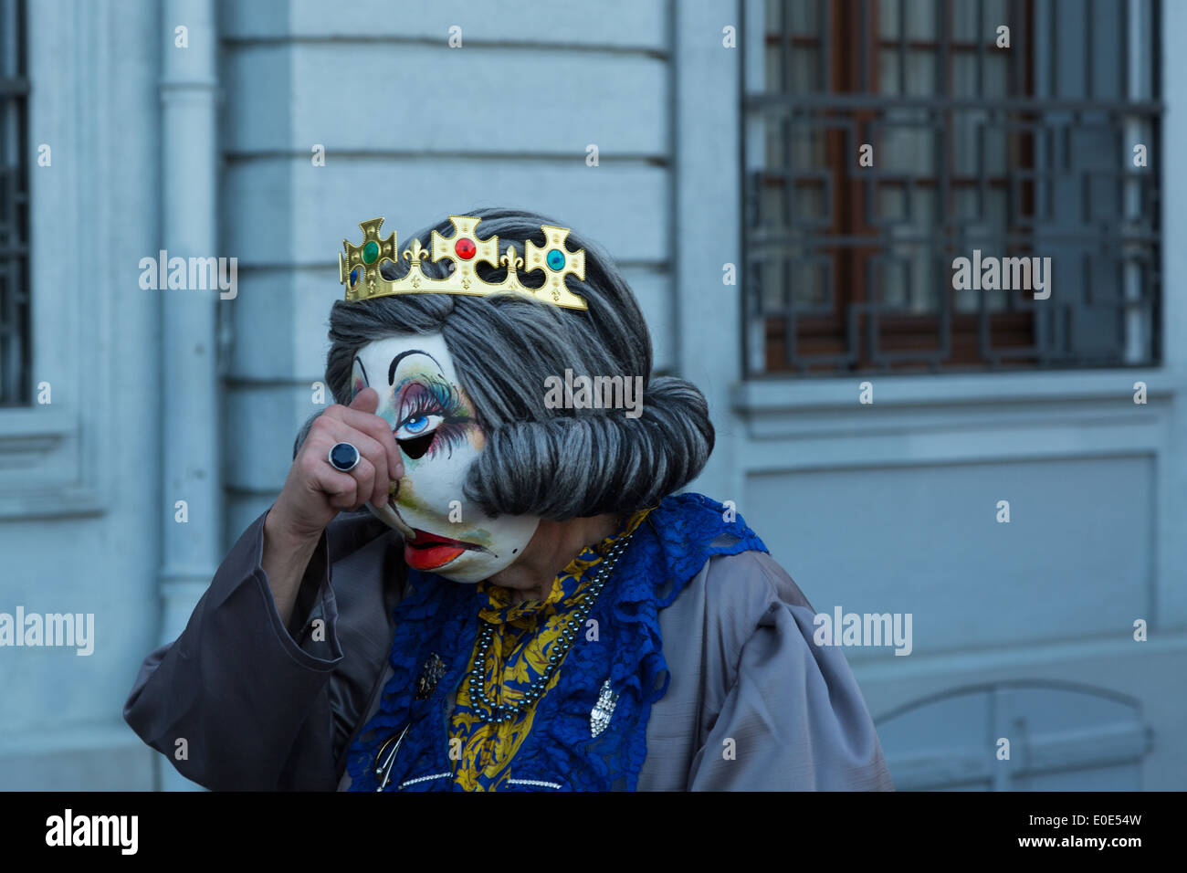 A photograph of an tired looking parade participant dressed up as the ...