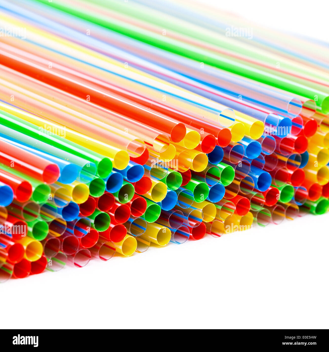 Colored Plastic Drinking Straws on a white background Stock Photo - Alamy