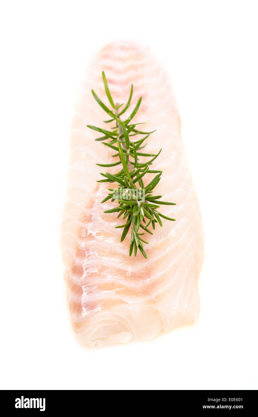Raw cod with green rosemary in vertical format Stock Photo - Alamy
