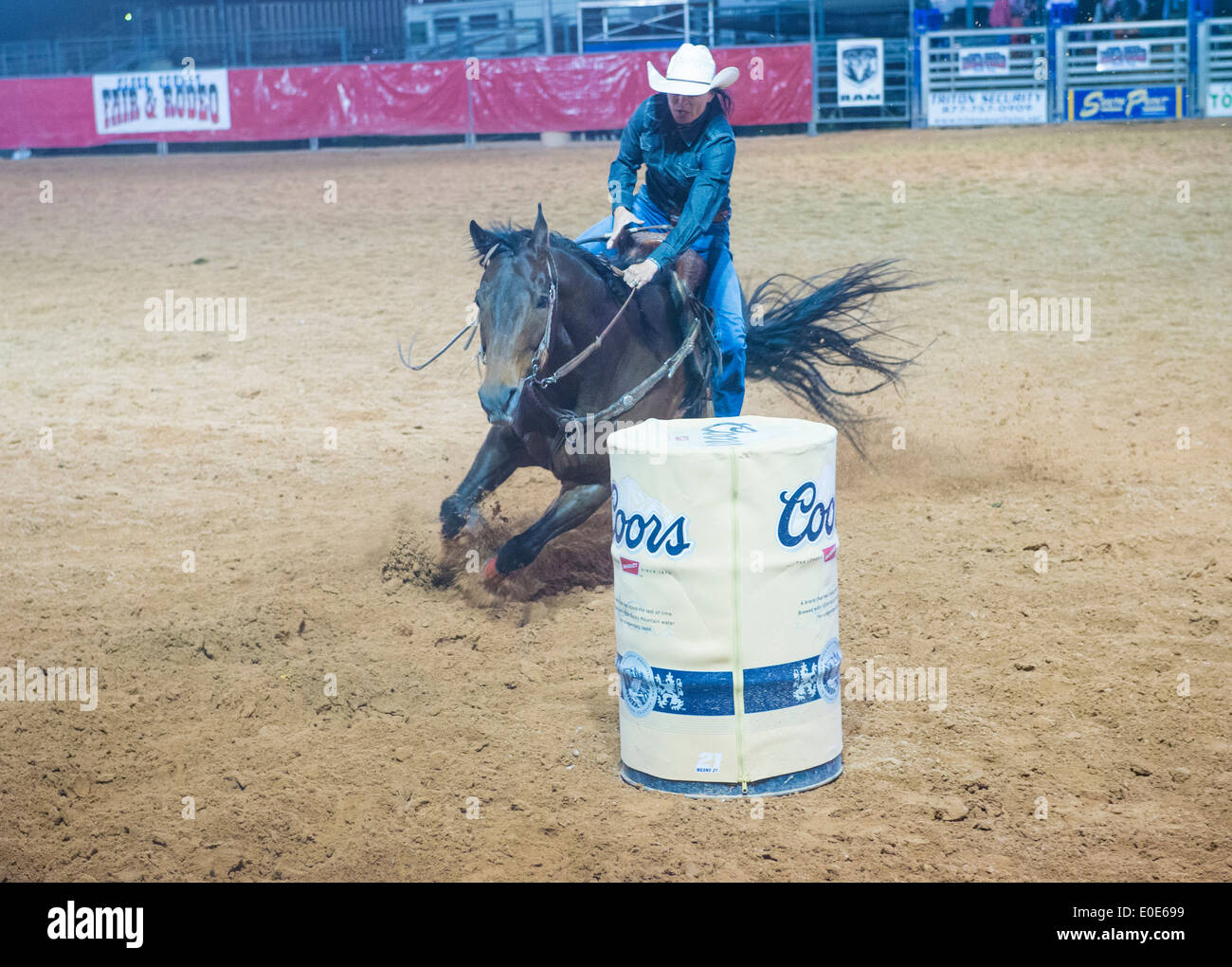 Cowgirl Participating in a Barrel racing competition in the Clark ...