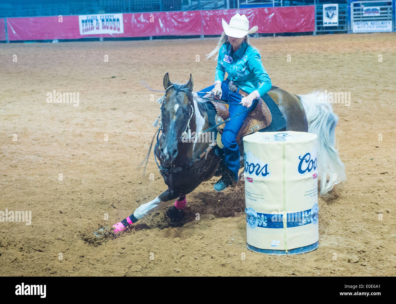 Cowgirl Participating in a Barrel racing competition in the Clark ...