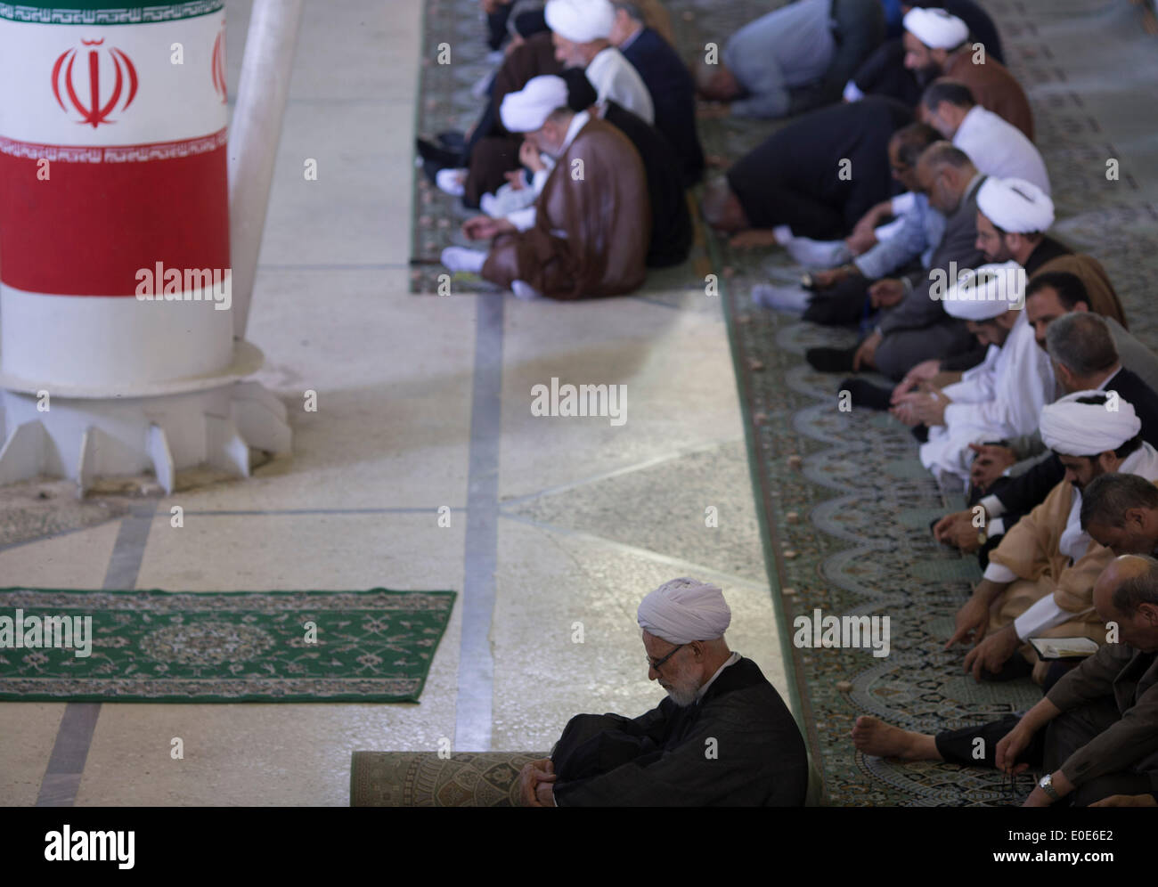 Tehran, Iran. 9th May, 2014. Iranian clerics sit in an outdoor area in ...