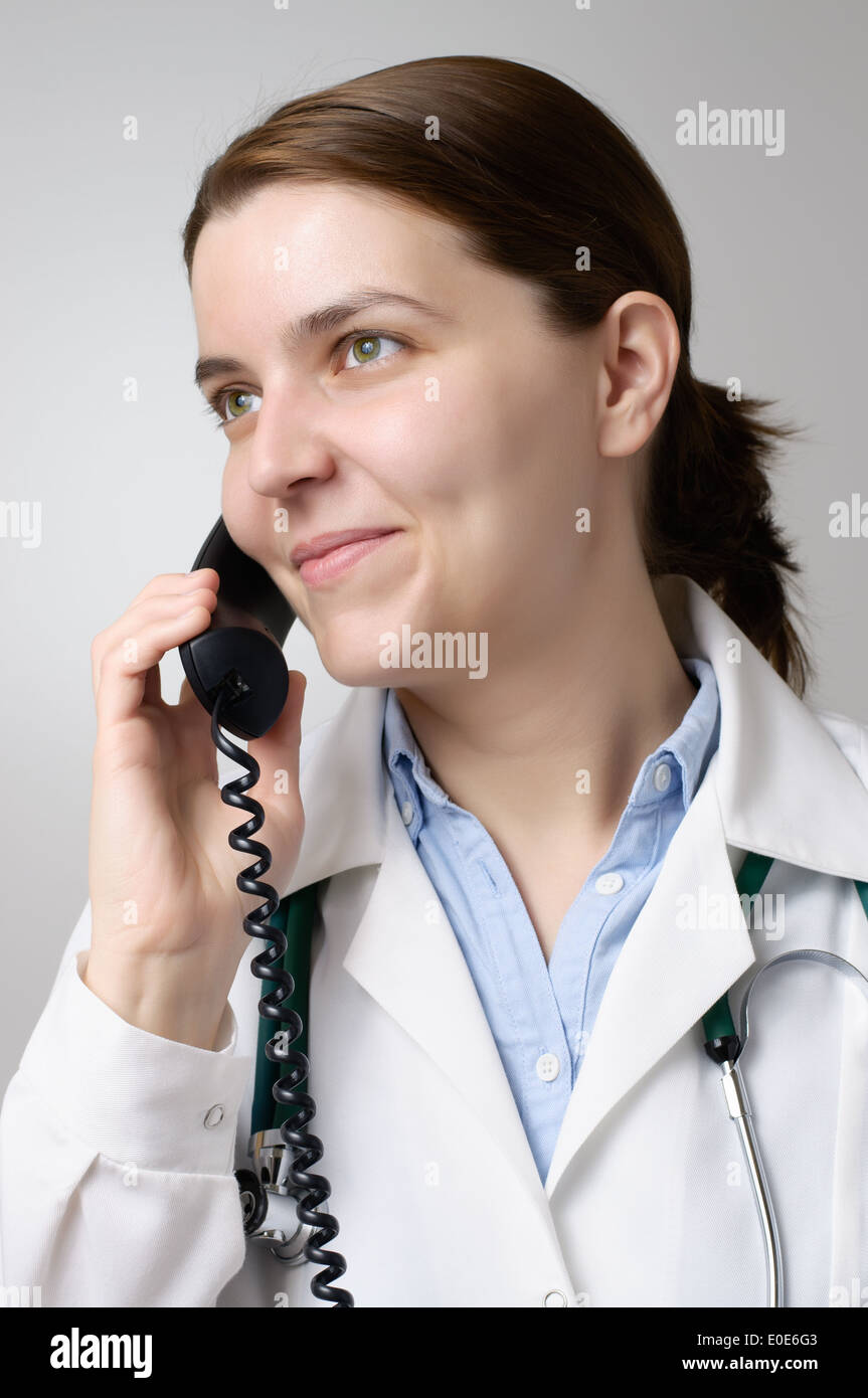 Doctor with telephone Stock Photo - Alamy