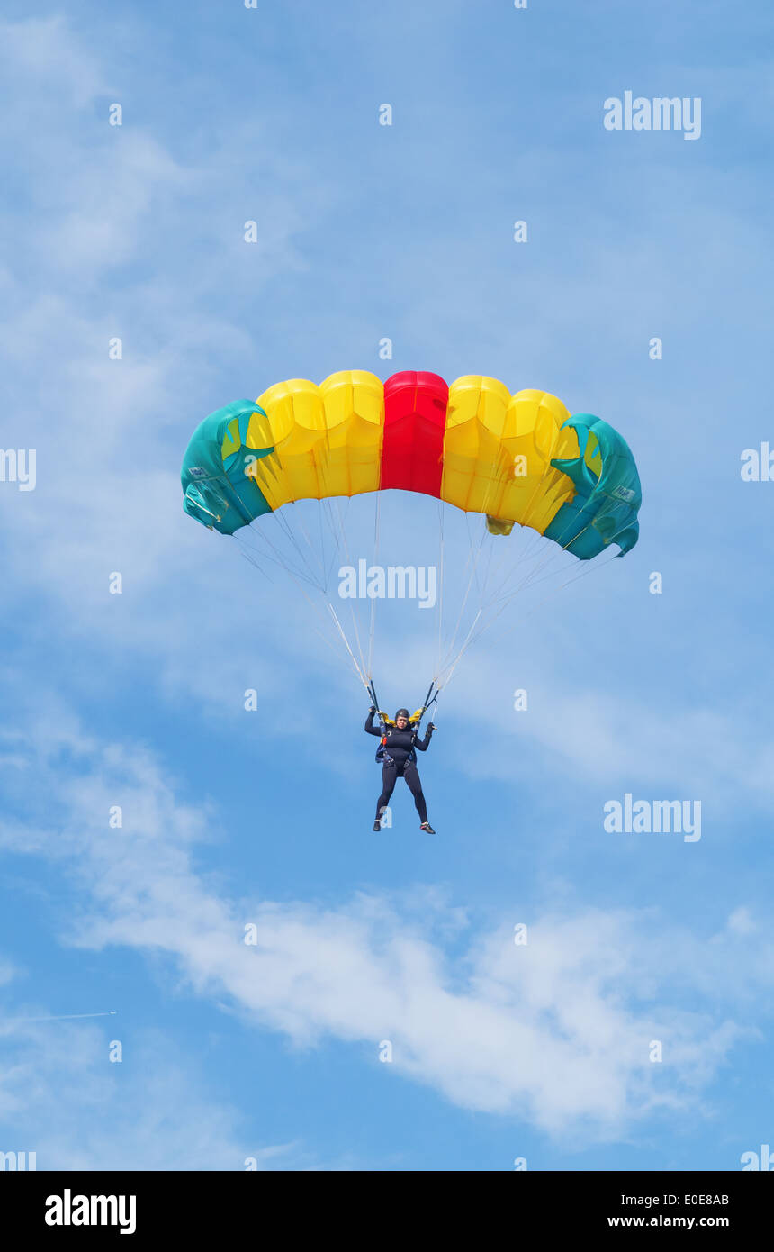 One day with parachutist in airfield. The girl skydiver landing under ...