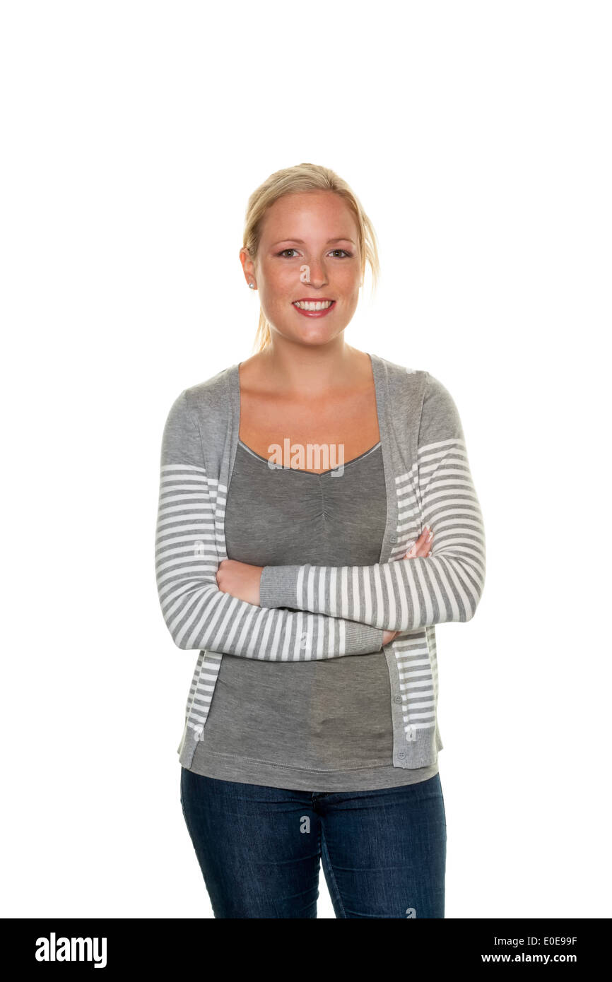 A young, likeable woman stands before white background. Half figure ...