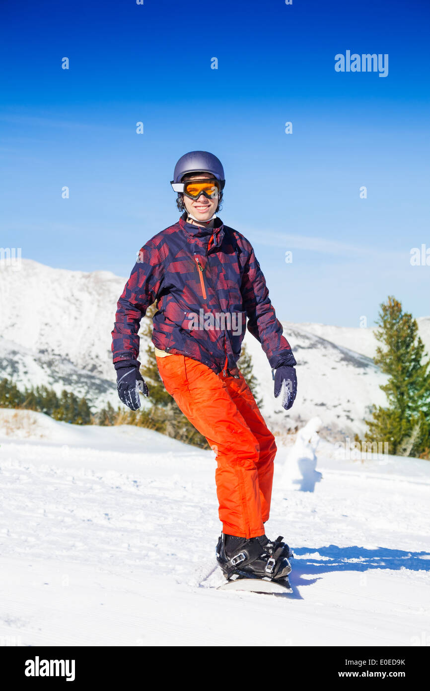 Man in ski mask standing on the snowboard Stock Photo - Alamy