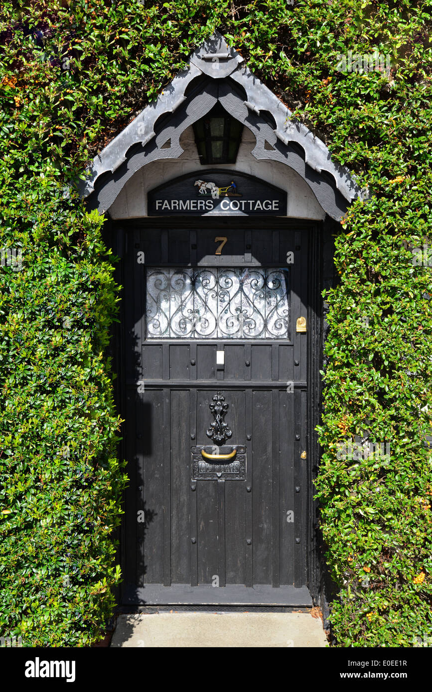 Ivy-clad front door of riverside house, The Hythe, Egham, Surrey ...