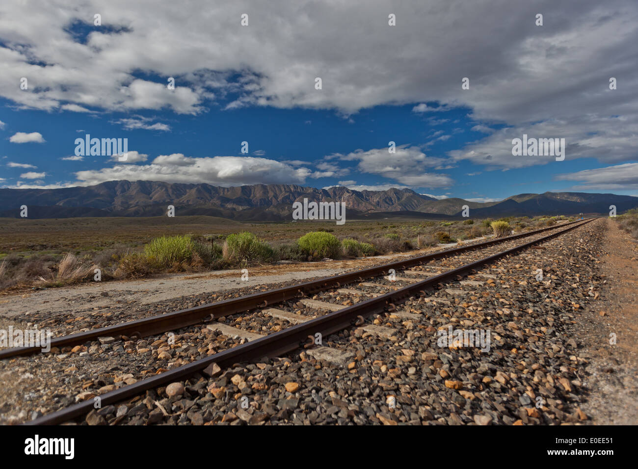 Railway train passing mountains hi-res stock photography and images - Alamy