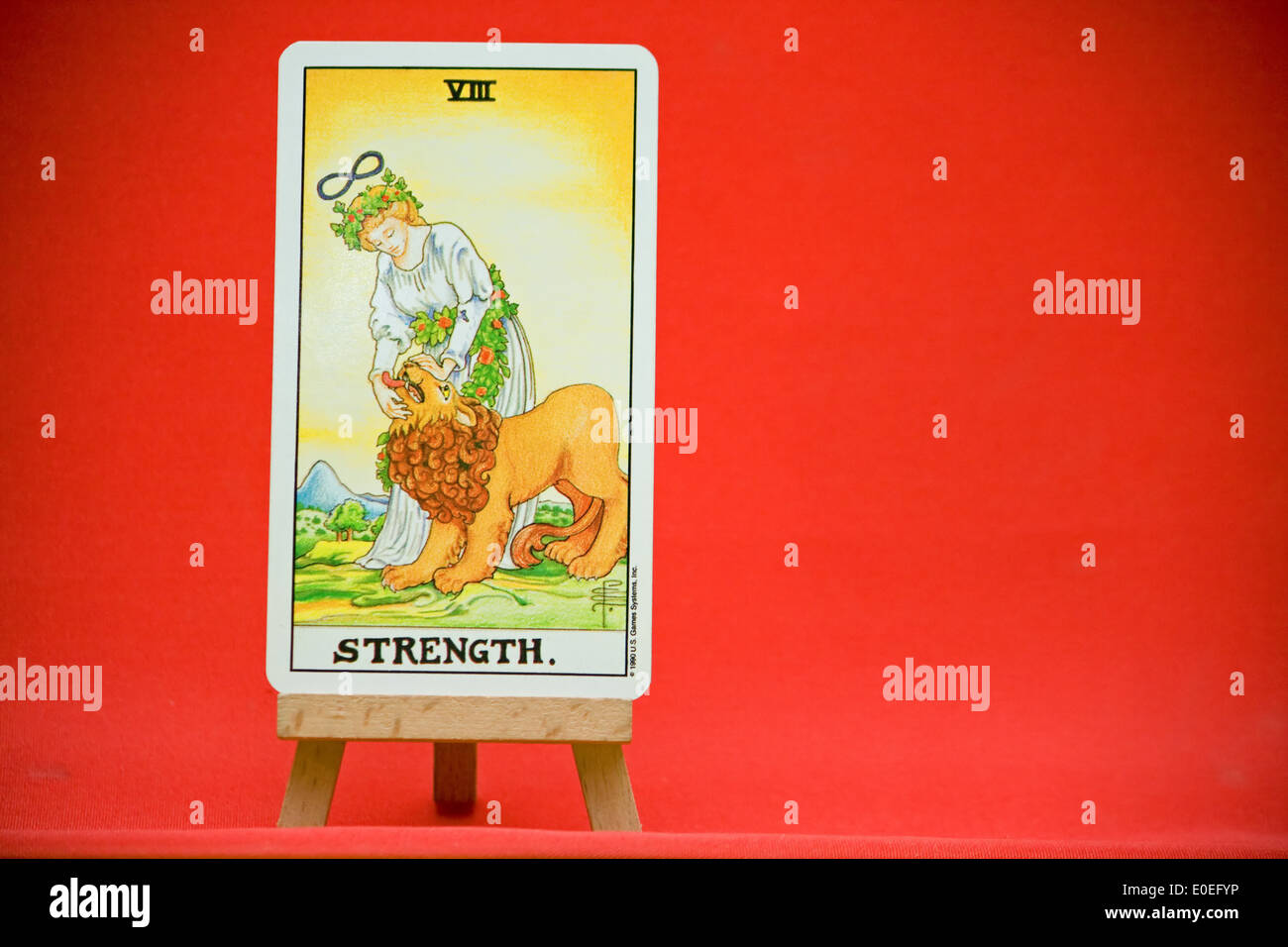 Strength card from the Universal Waite tarot deck Stock Photo - Alamy