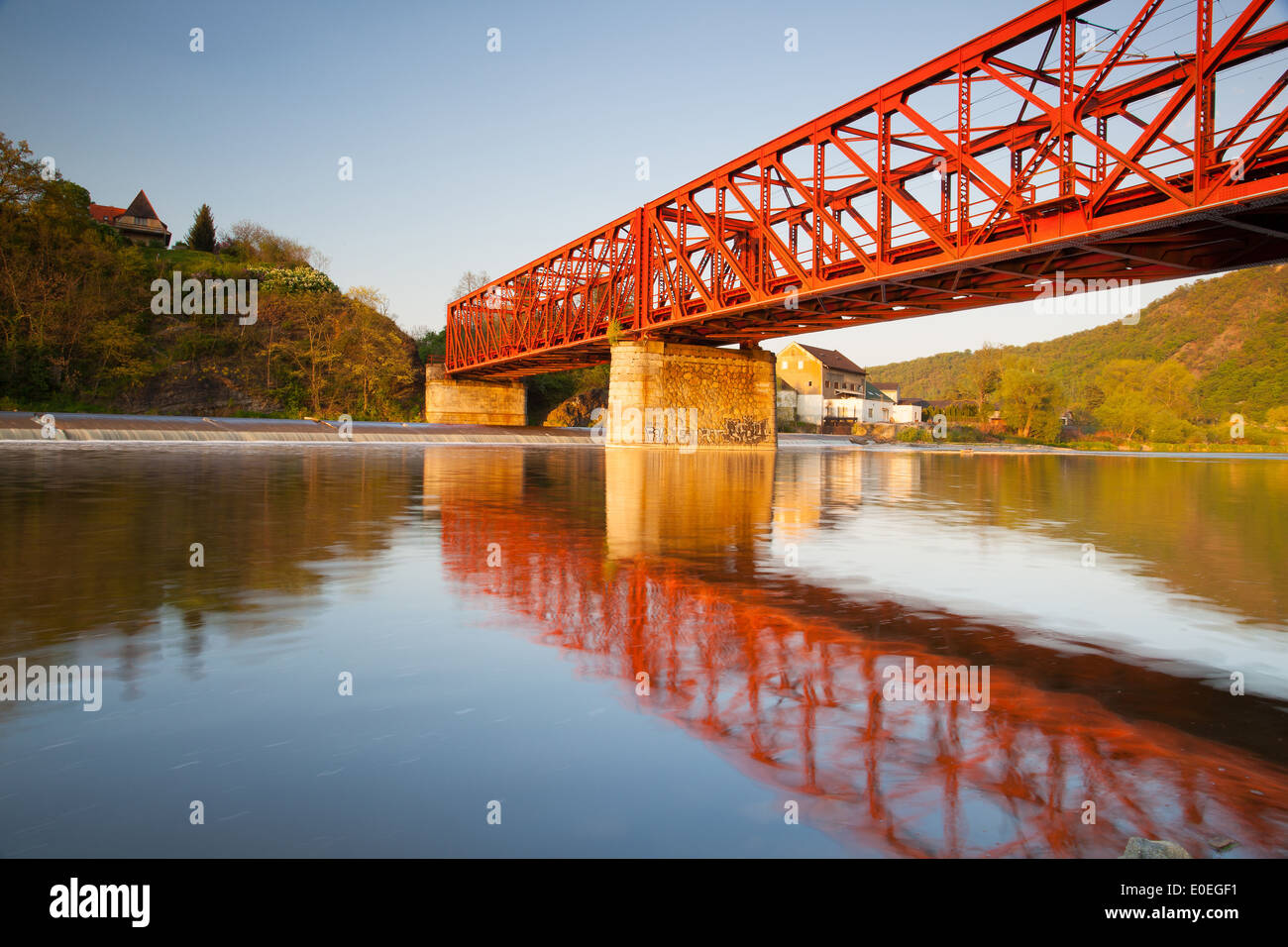 The old iron railway bridge over the river at sunset Stock Photo - Alamy