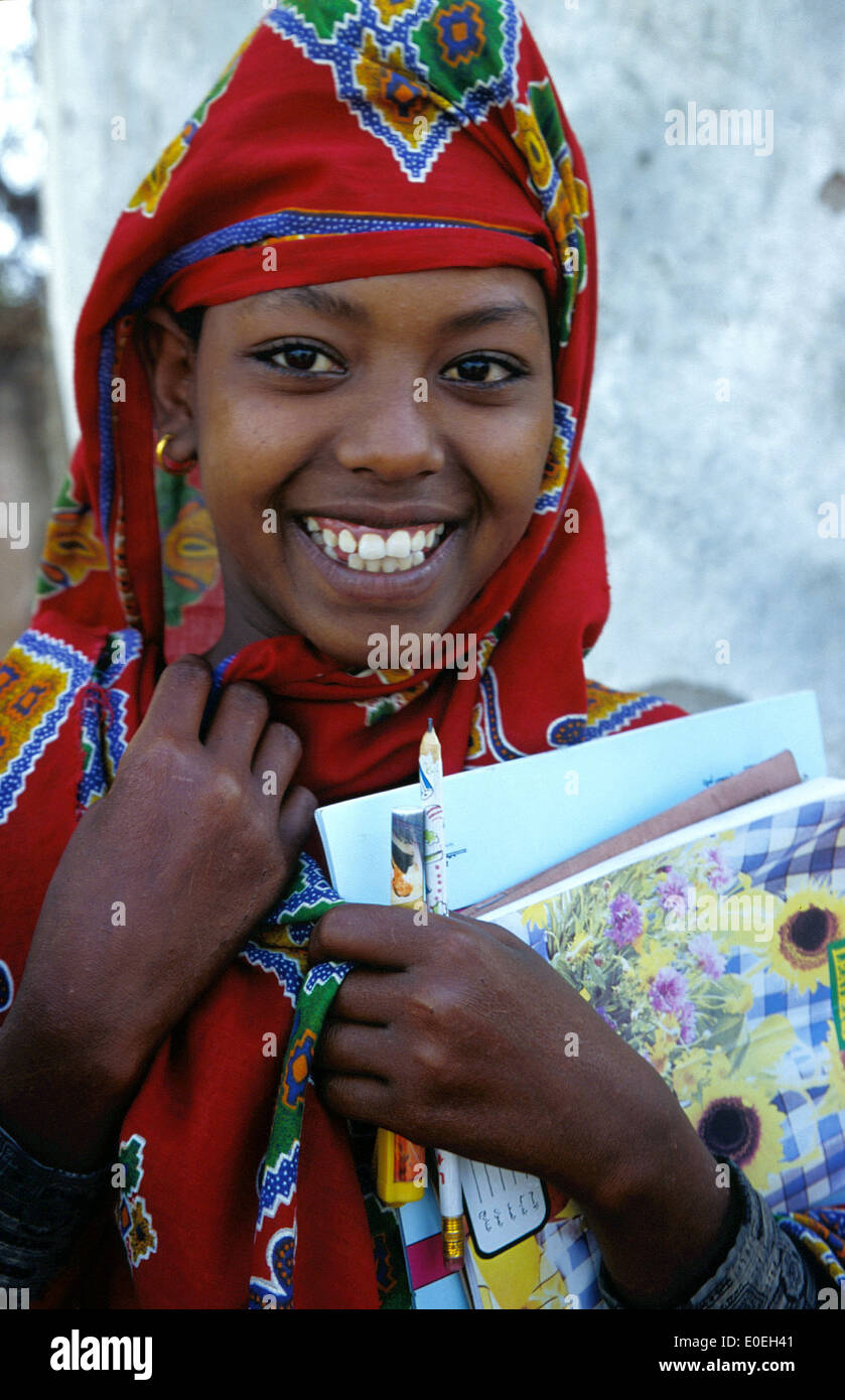 Smiling somali student holding school books hi-res stock photography ...