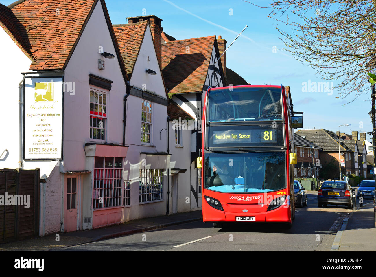Double-decker bus passing 12th century Ostrich Inn, High Street ...