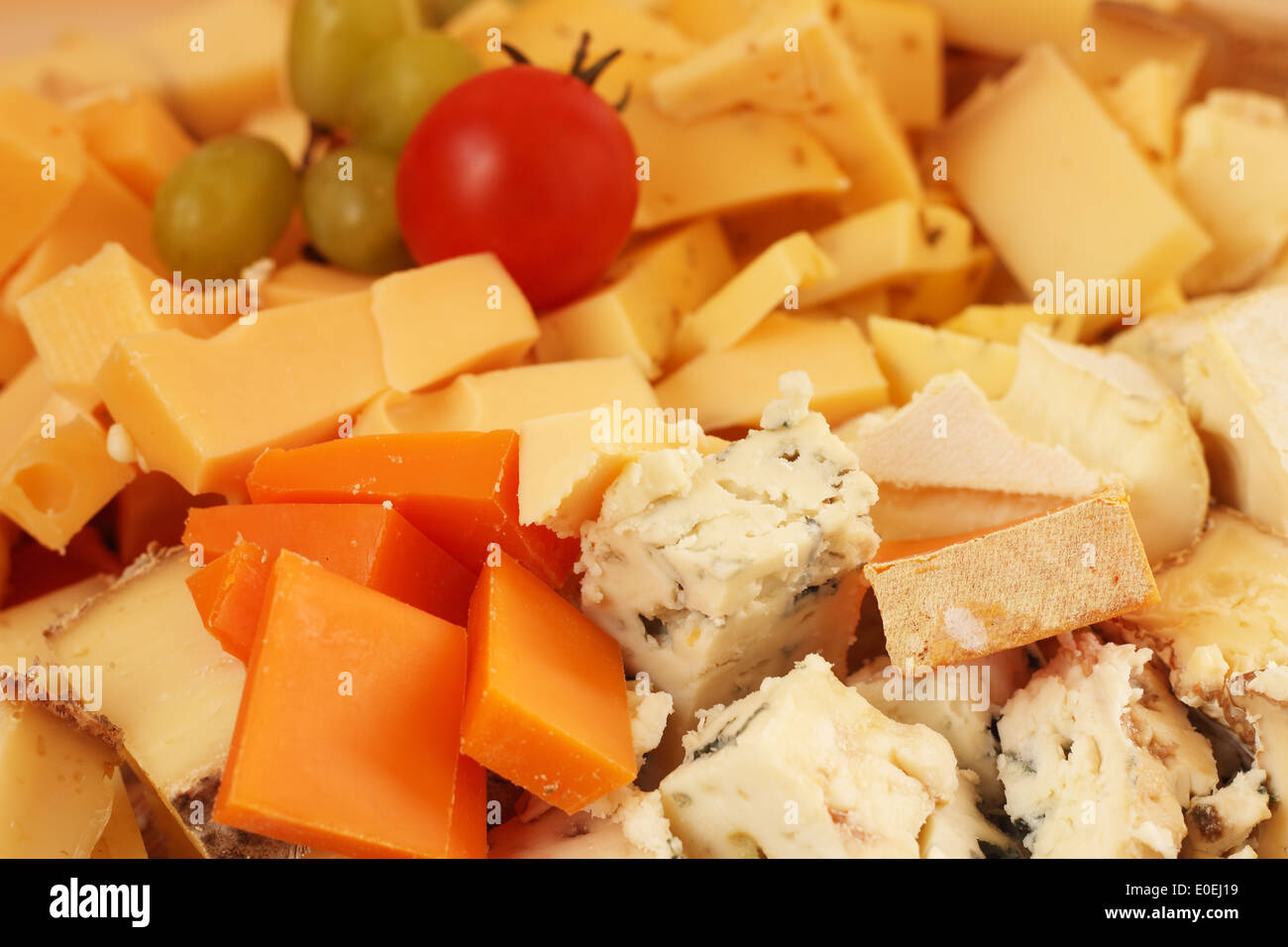 Cut french cheese blocks background close-up Stock Photo - Alamy