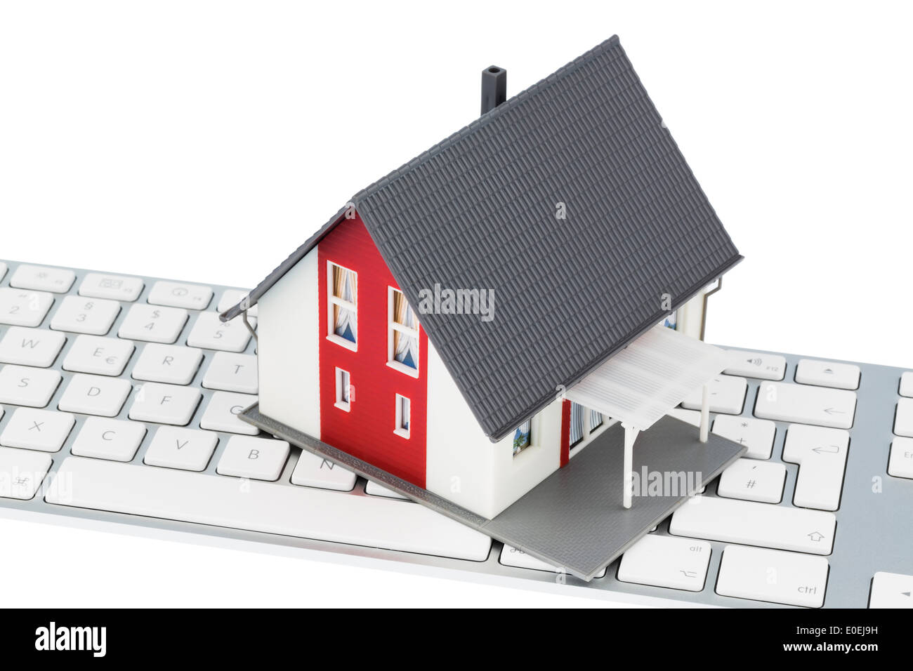 Dwelling house on keyboard, symbolic photo for house purchase and ...